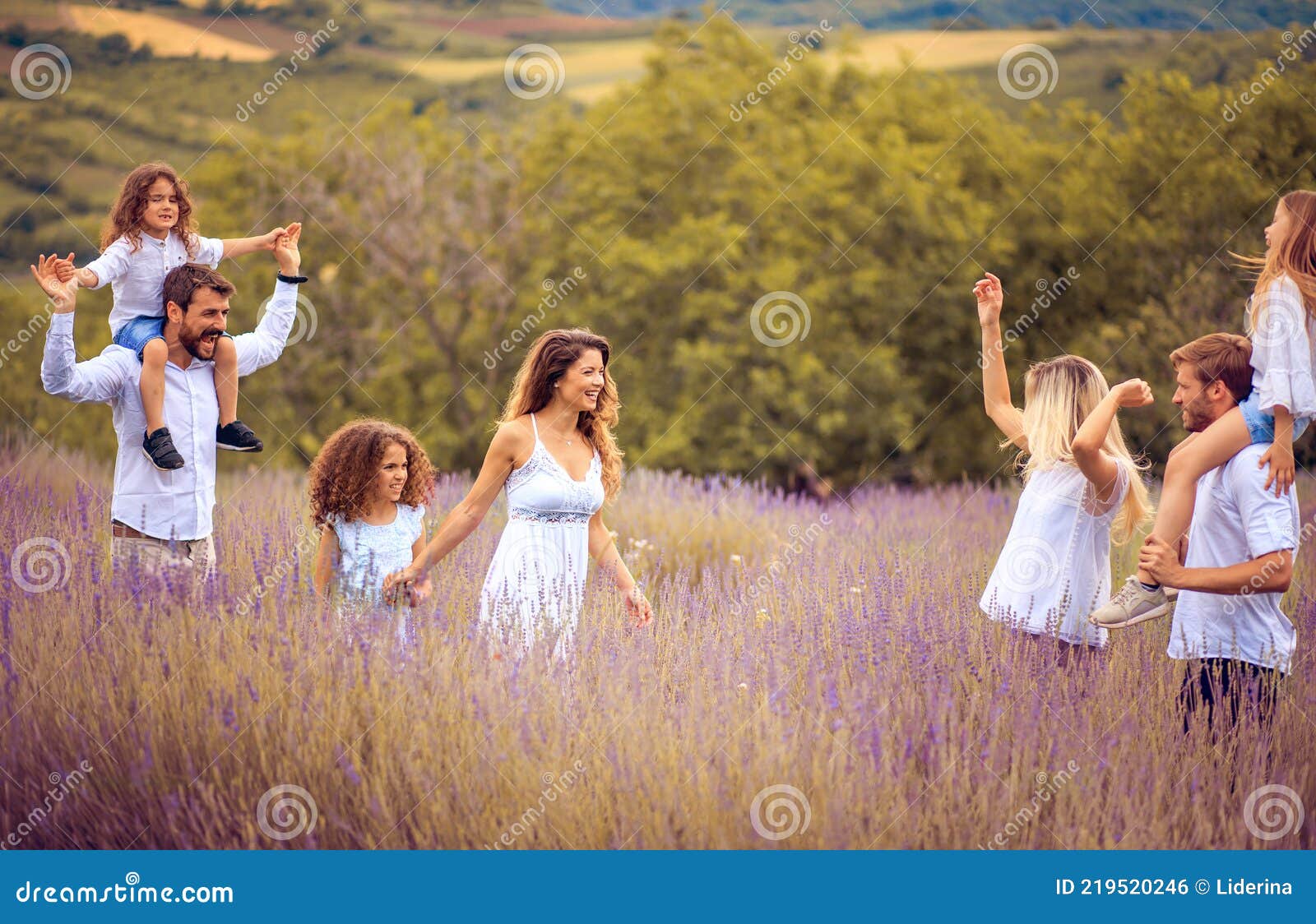 Group of People in Lavender Field Stock Photo - Image of carrying ...
