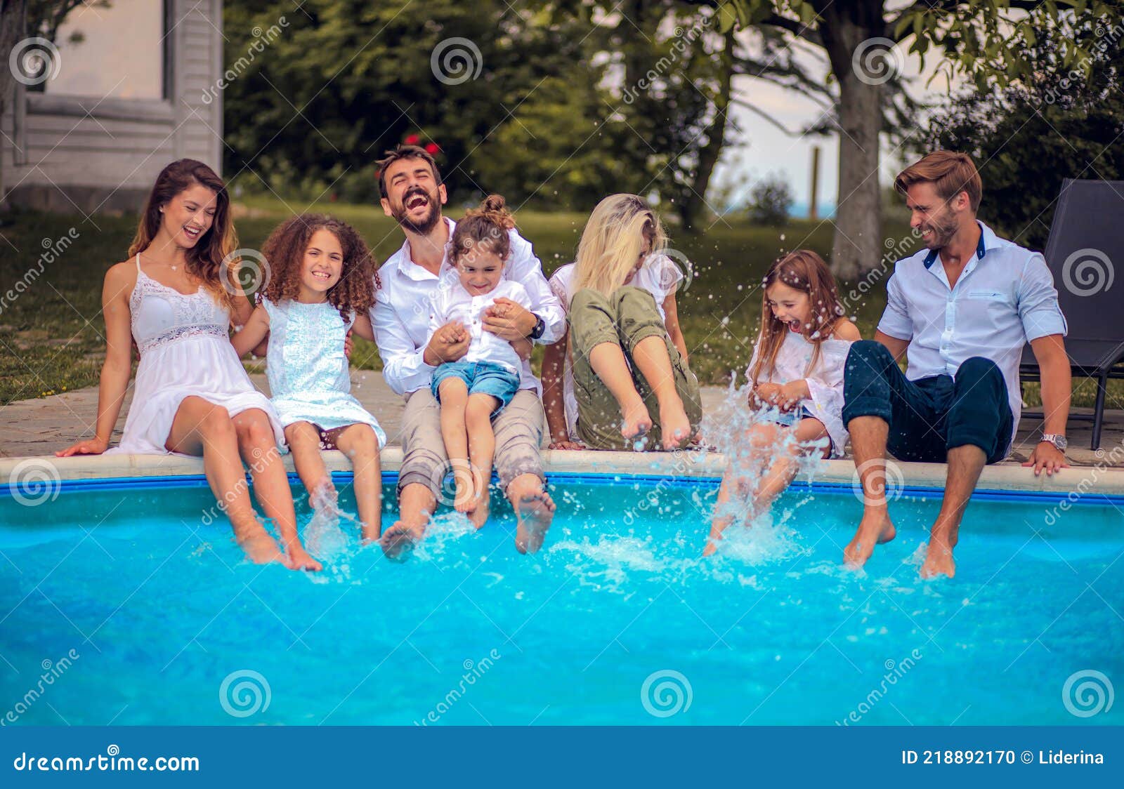Group of People Sitting by the Swimming Pool Stock Photo - Image of ...