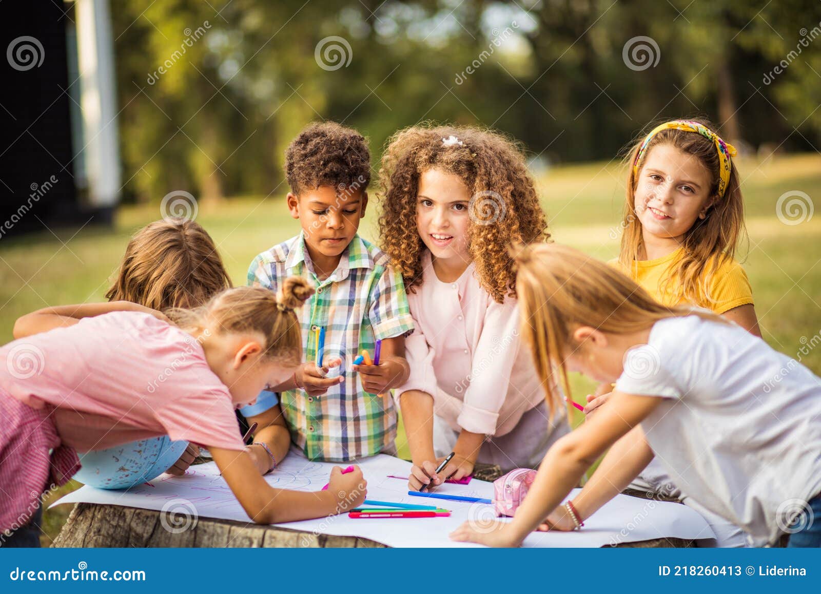 Large Group of People Writing Together in the Park Stock Image - Image ...