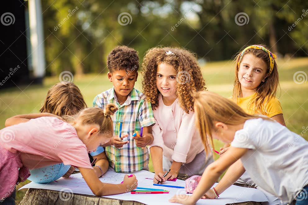 Large Group of People Writing Together in the Park Stock Image - Image ...
