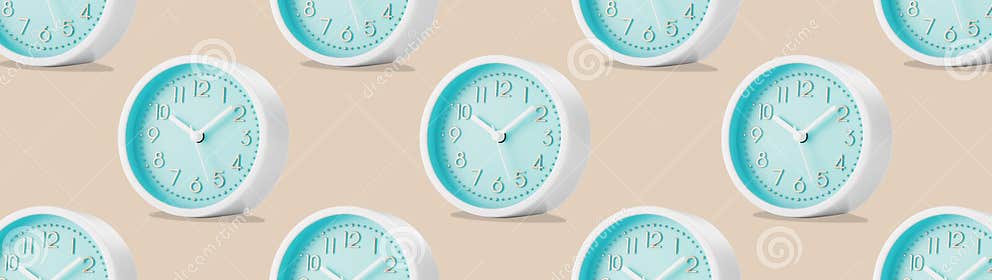 Large Group of Round Analog Table Clocks with on a Beige Plain ...