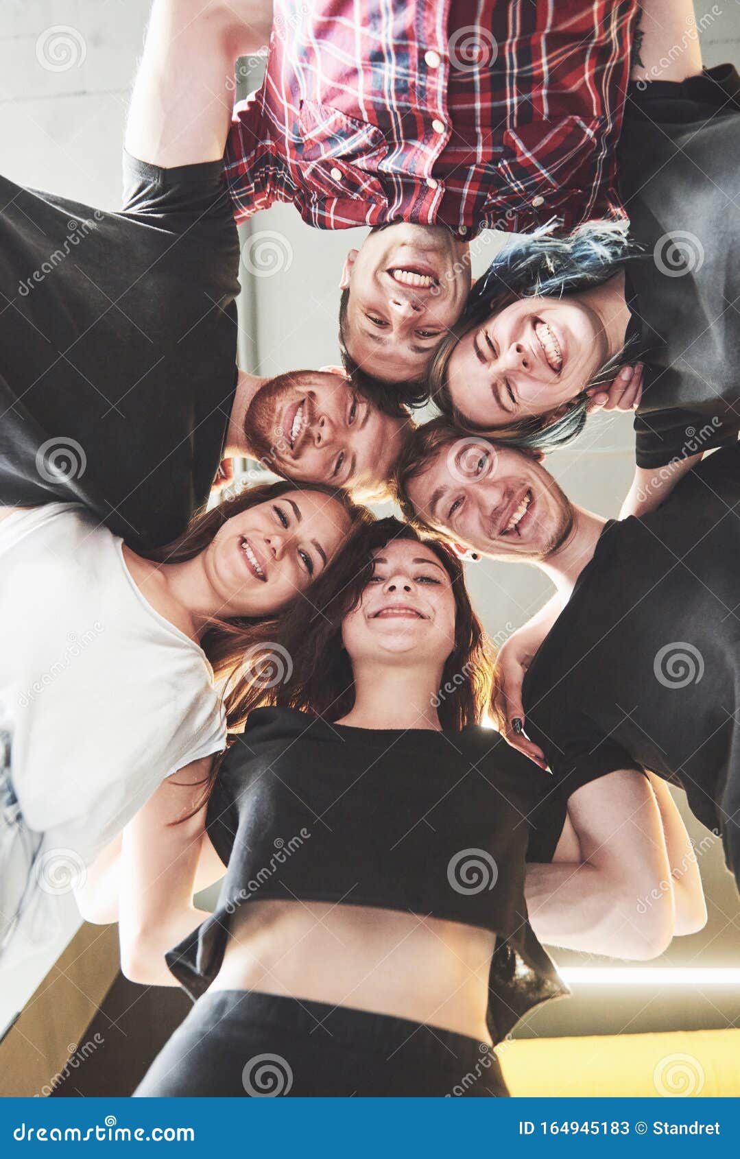 A Large Group of Smiling Friends Hugging Together. Stock Image - Image ...
