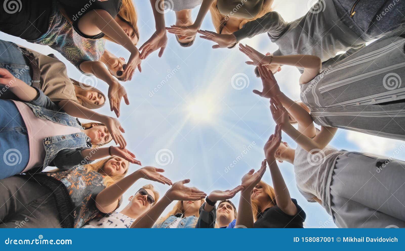 A Large Group of Students Makes a Circle Out of Their Hands. Stock ...