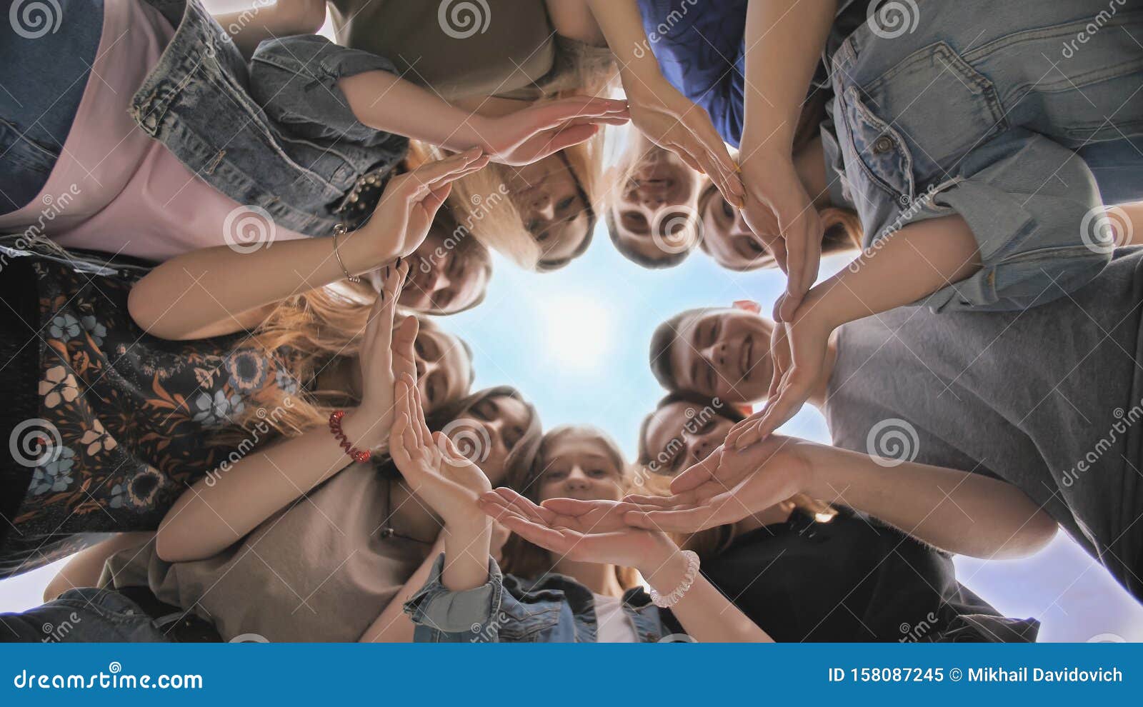 A Large Group of Students Makes a Circle Out of Their Hands. Stock ...
