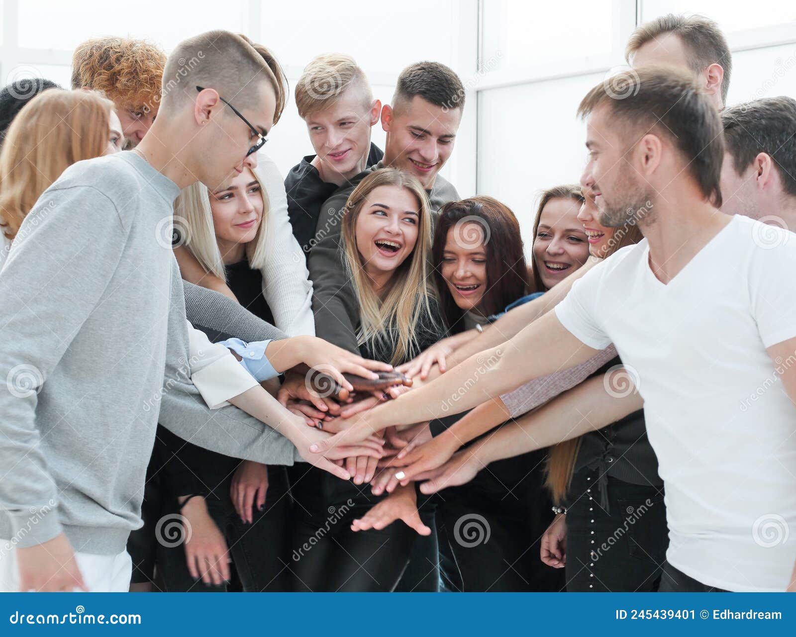 Large Group of Young People Joining Their Hands Together. Stock Image ...