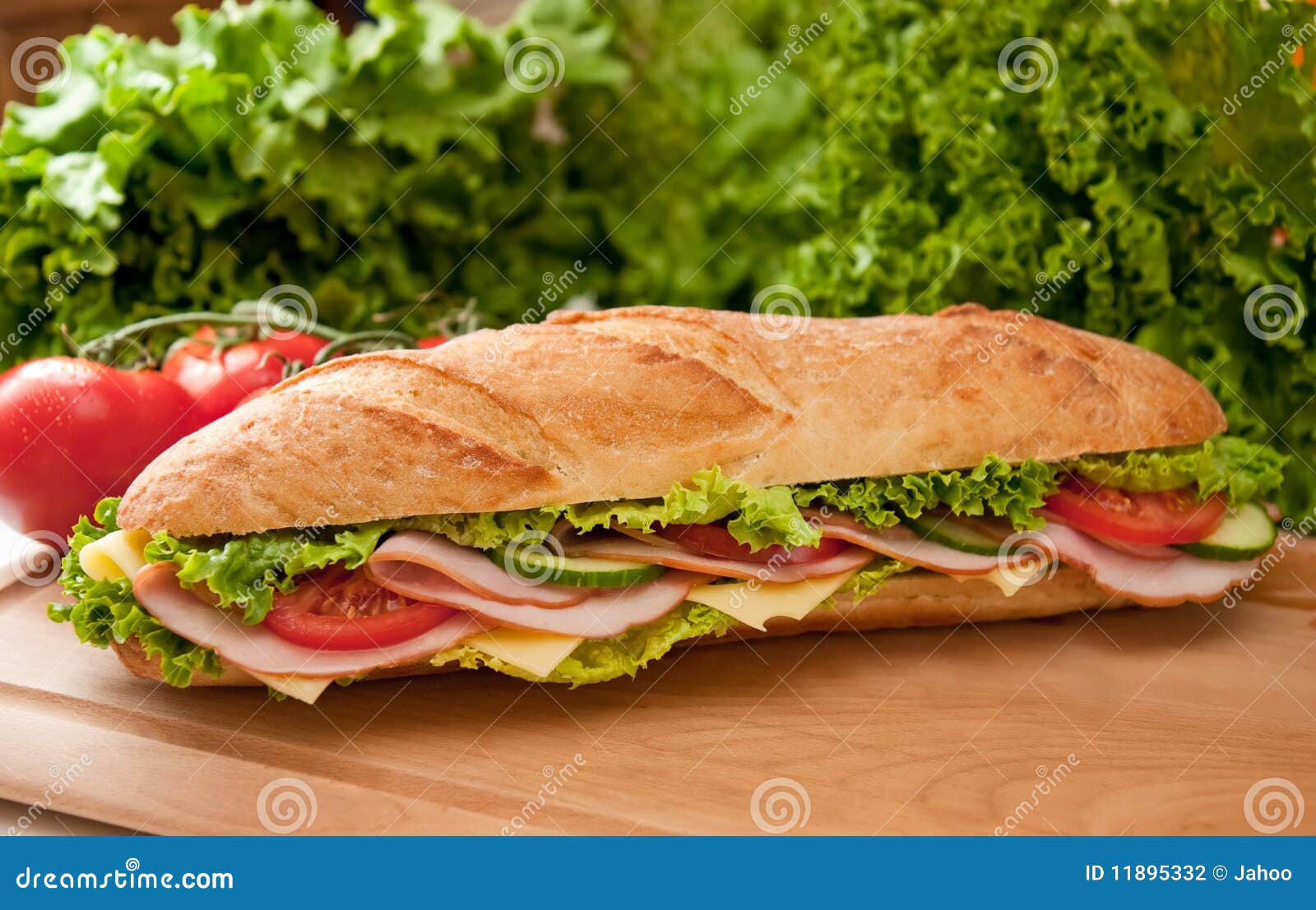 Large Ham & Swiss Submarine Sandwich. Stock Photo - Image of cucumbers ...