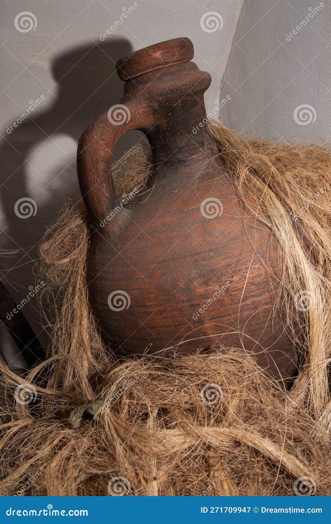 Large Handmade Ceramic Jug Wrapped in Tow for Better Preservation Stock ...