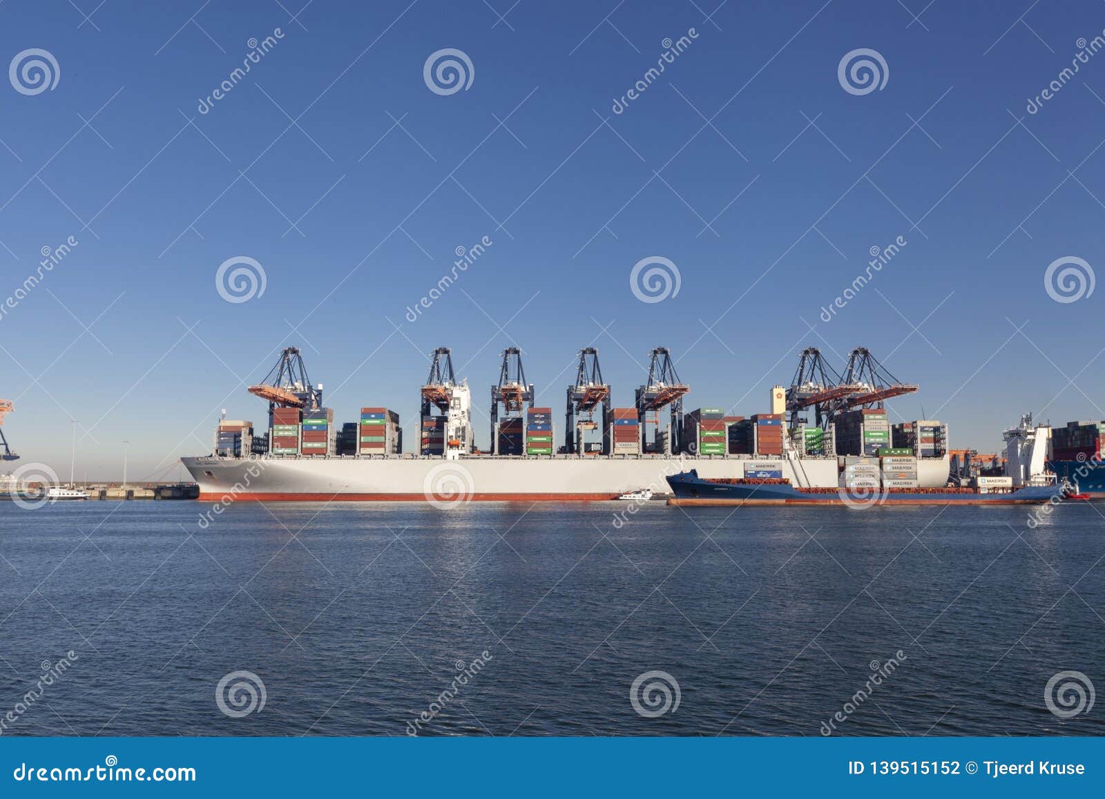 Large Harbor Cranes Loading Container Ships in the Port of Rotterdam ... Large Harbor Cranes Loading Container Ships in the Port of Rotterdam ...