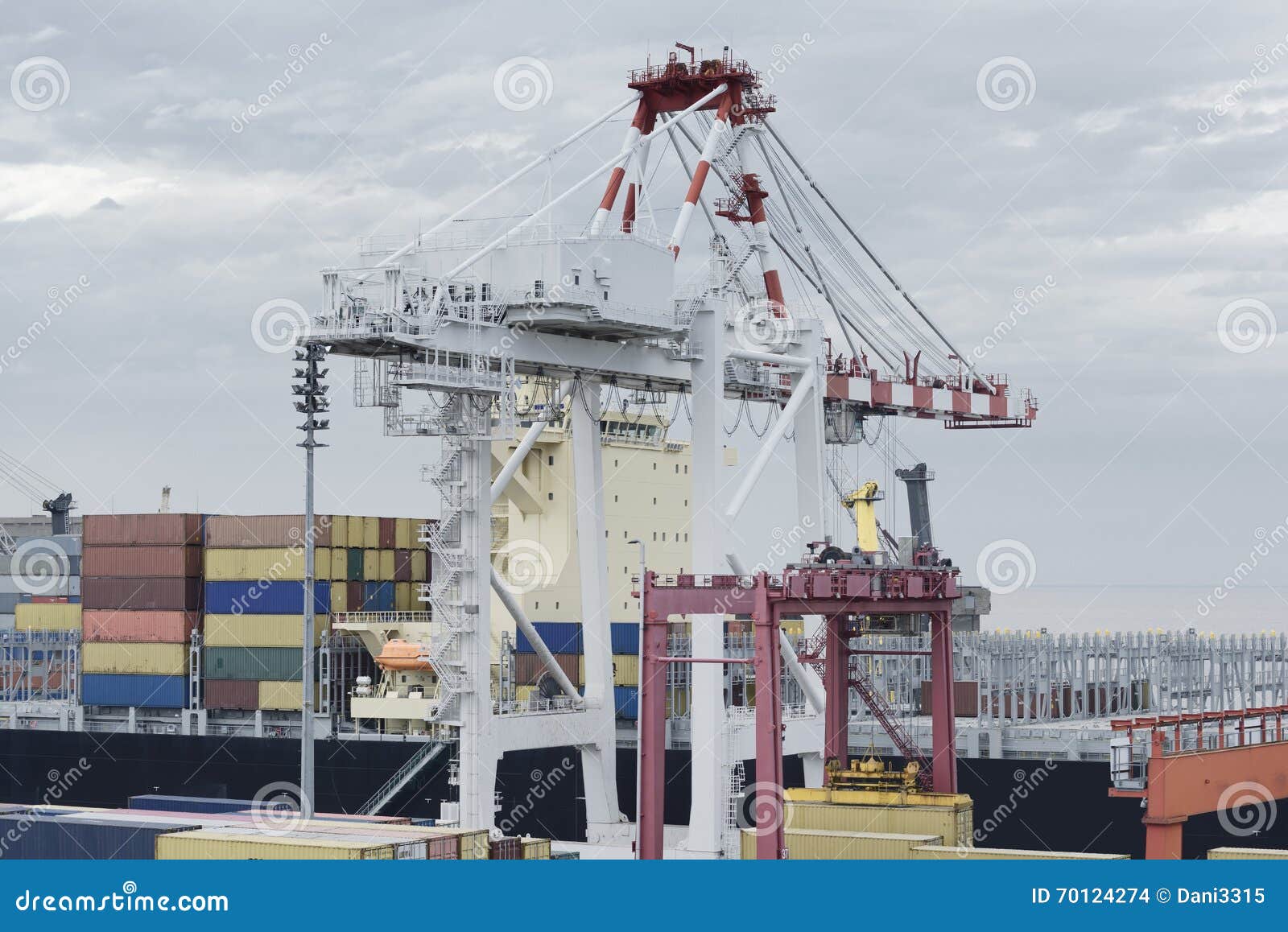 Large Harbour Crane Loading Containers on a Cargo Vessel Stock Photo ...