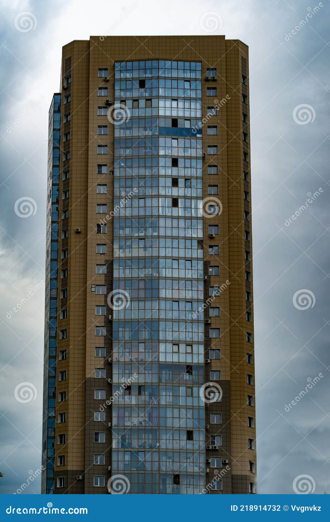 A Large High-rise Building Against a Blue Sky on a Construction Site ...