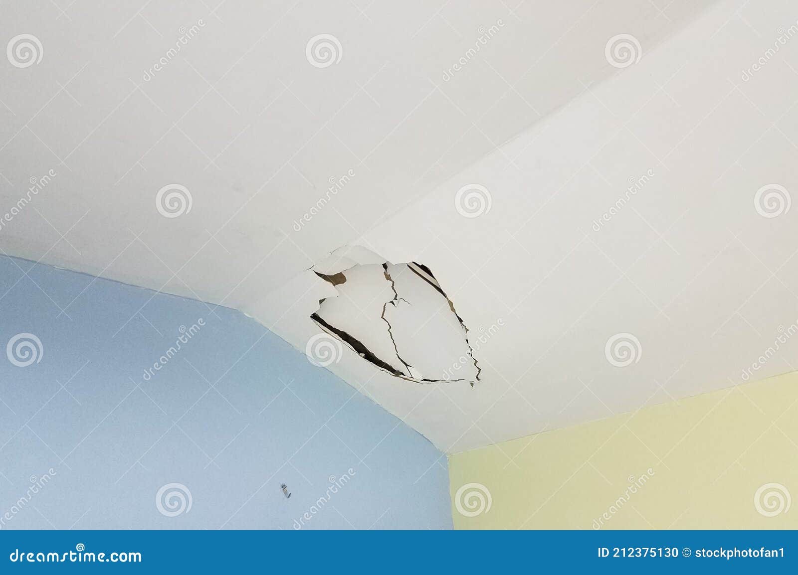 Large Hole in Drywall in Bedroom Ceiling Stock Photo - Image of broken ...