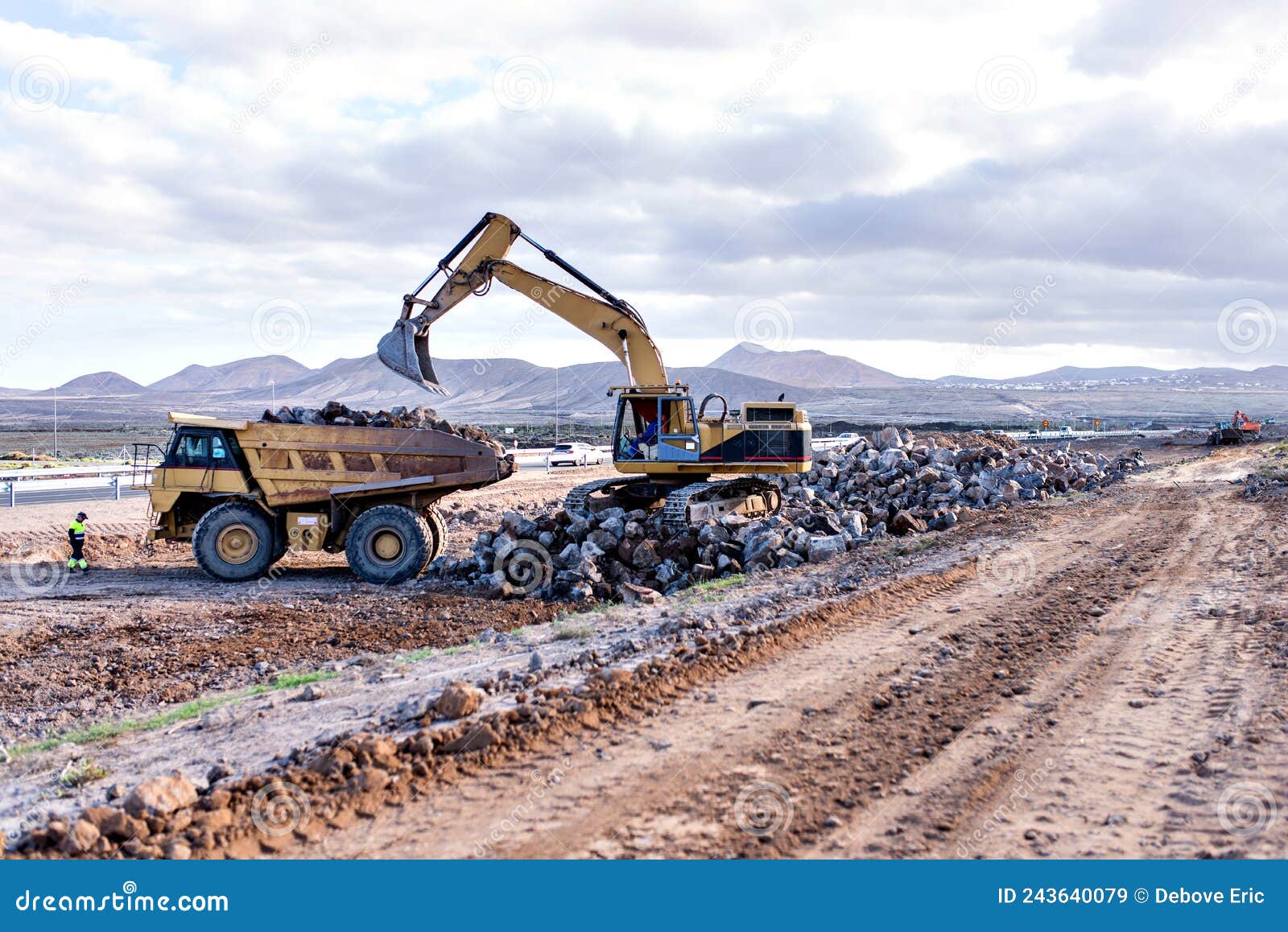 Large Hydraulic Excavators and Dumper Working As a Team on a ...