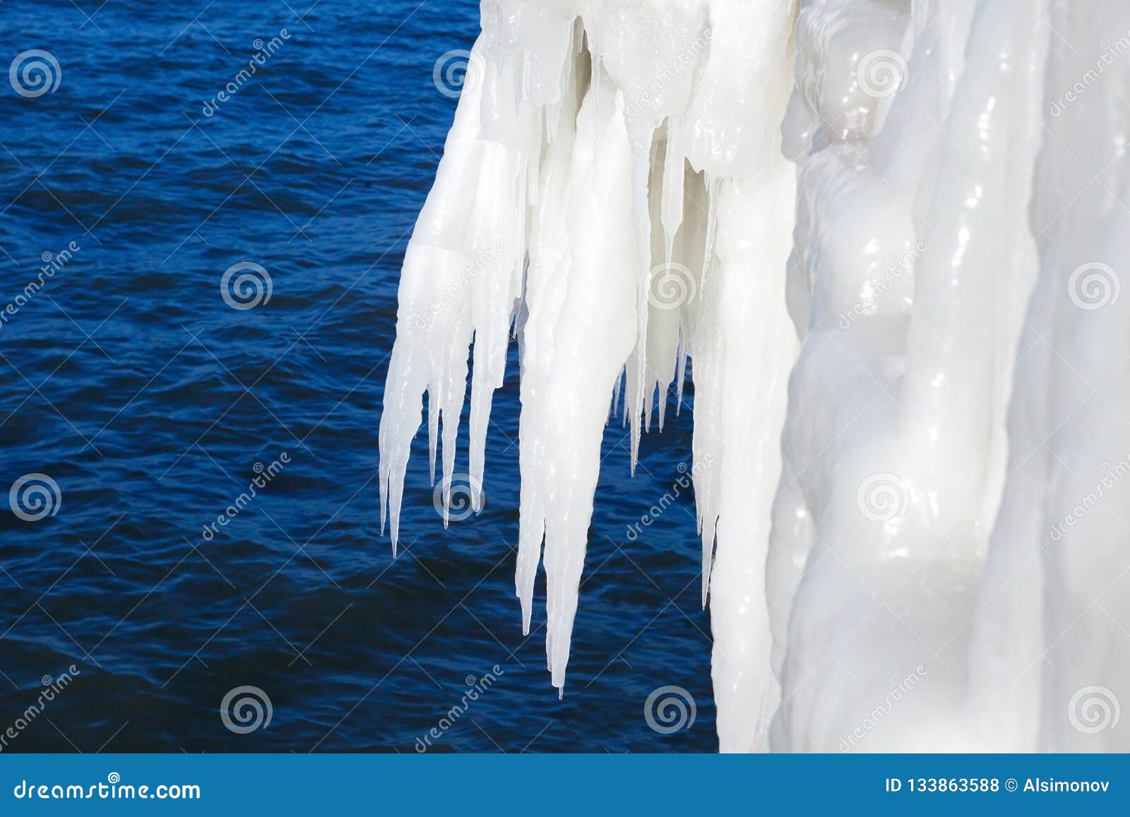 Large Icicles on a Background of the Sea. Ice Storm. Stock Photo ...