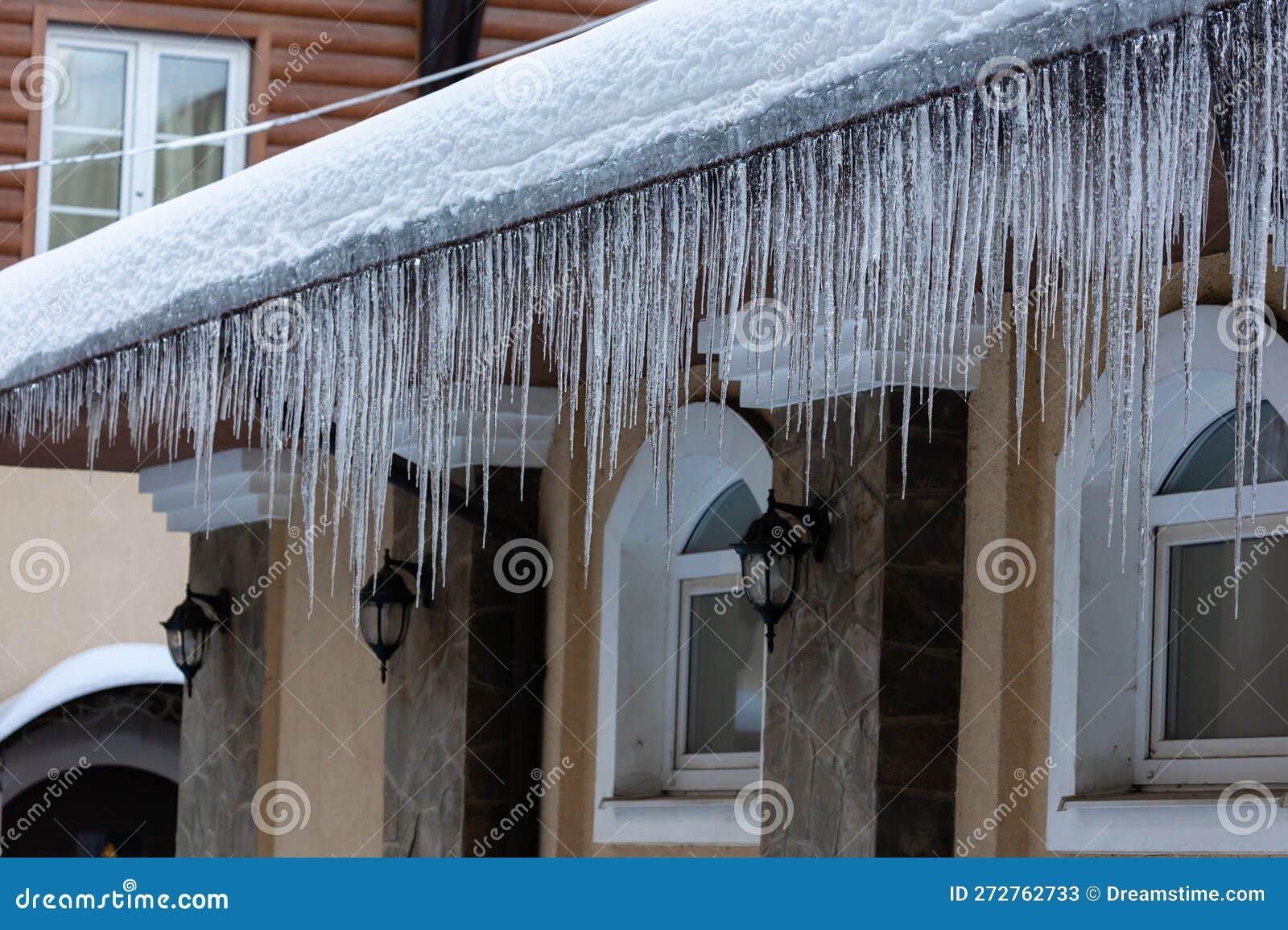 Large Icicles on the Roof of the House. Danger from Falling Icicles ...