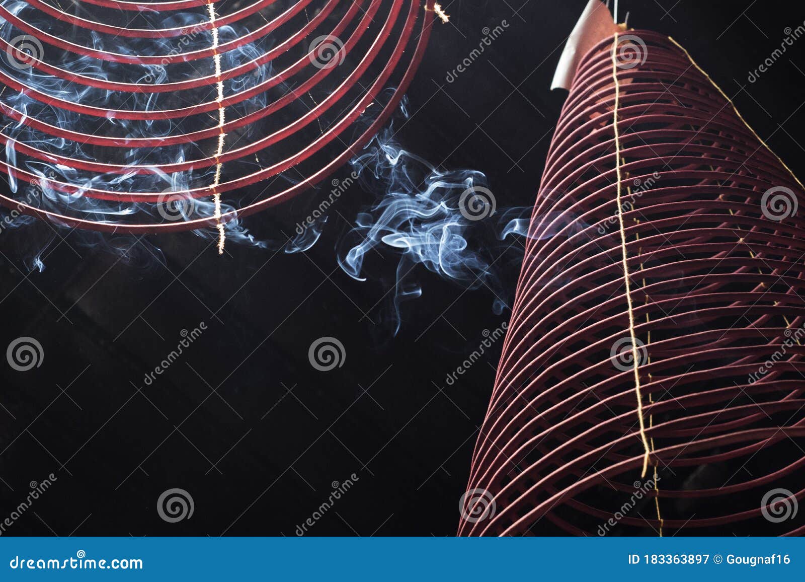 Large Incense Coils Burning Hanging from the Ceiling of a Vietnamese ...