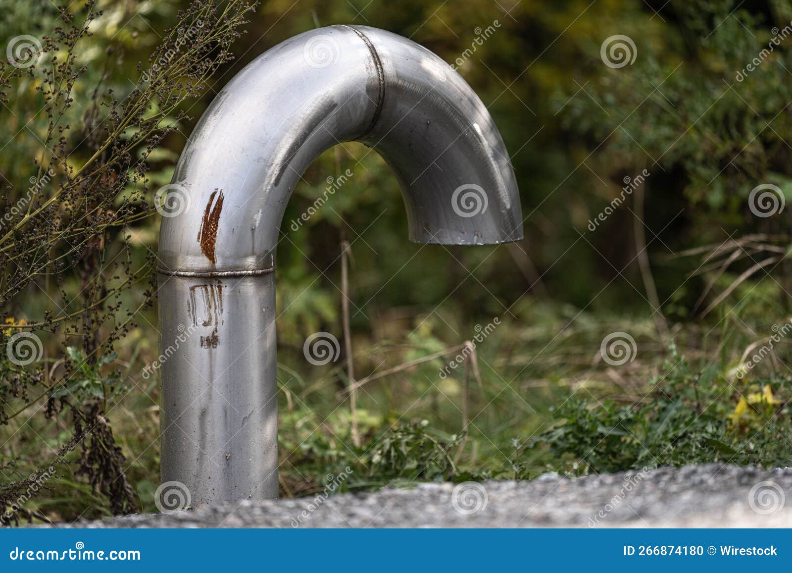 Large Industrial Curved Silver Pipe in a Park Stock Photo - Image of ...