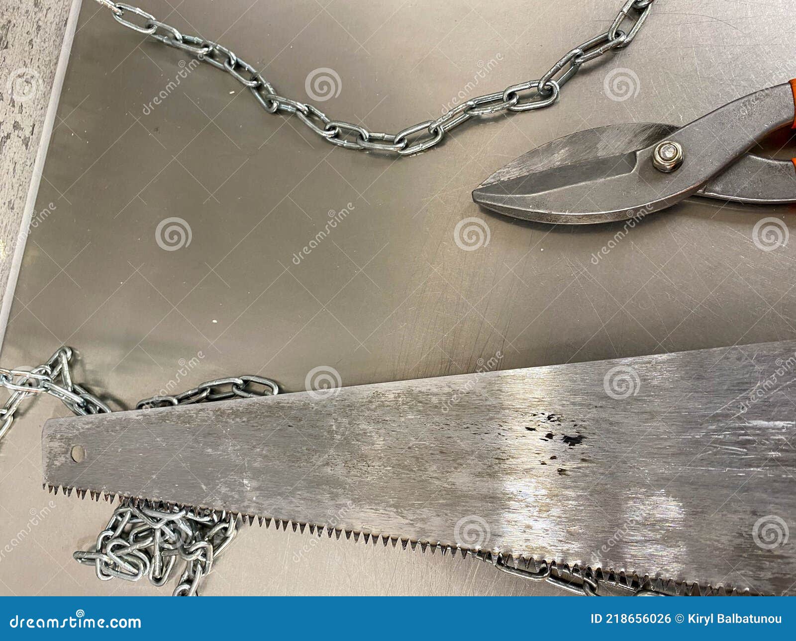 Large Iron Sharp Metal Scissors, Metal Cutters and a Saw with Chains ...