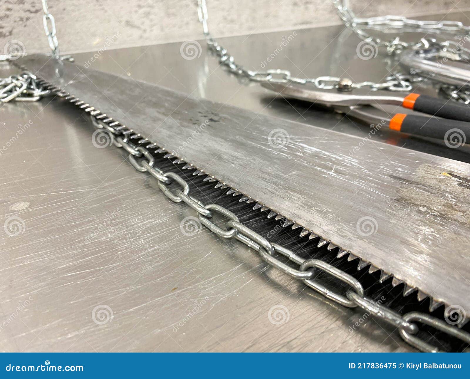 Large Iron Sharp Metal Scissors, Metal Cutters and a Saw with Chains ...