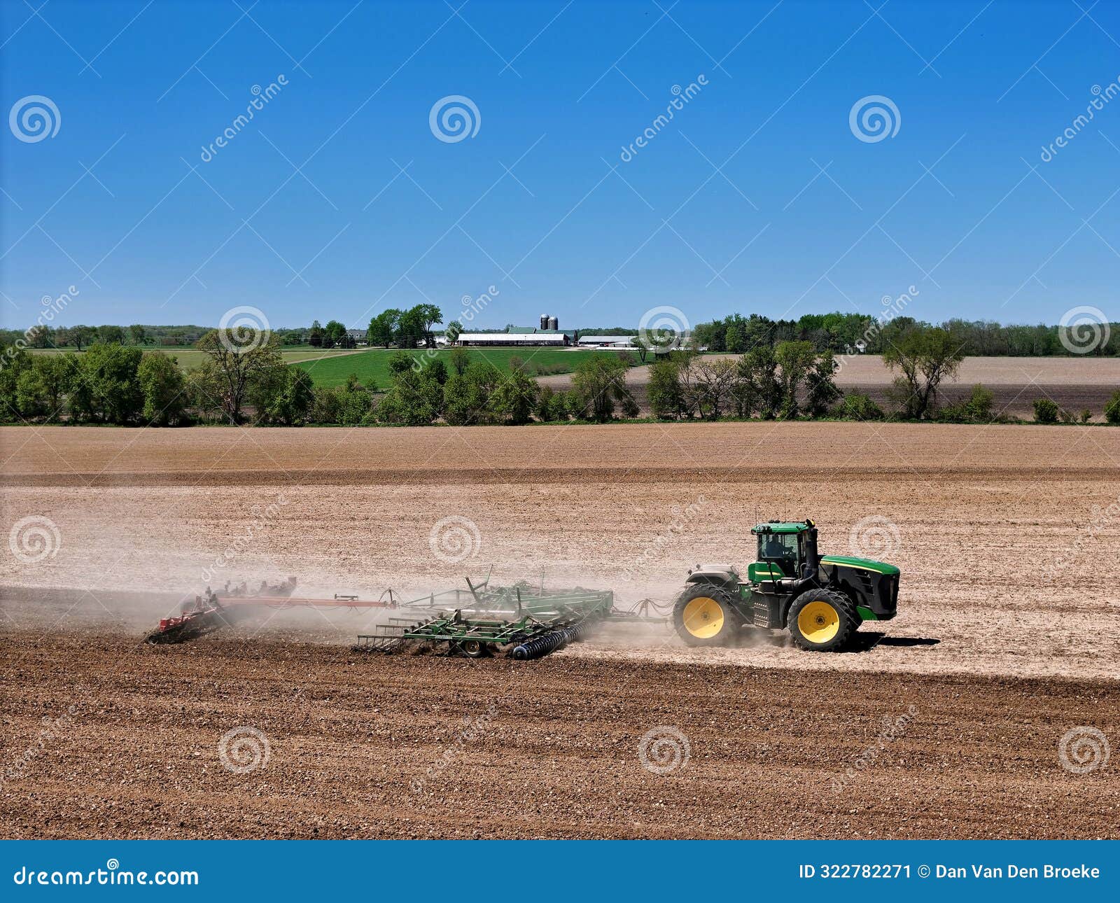 Large John Deere Tractor Pulling a John Deere Disk Cultivator Editorial ...