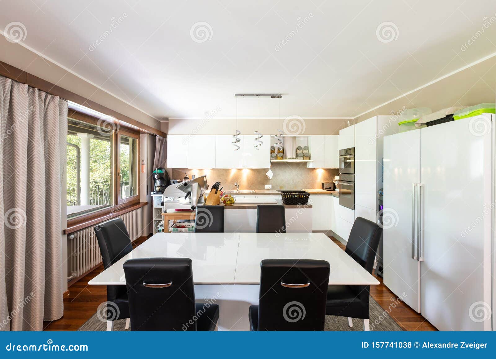 Large Kitchen with Leather Table and Chairs Stock Photo - Image of ...