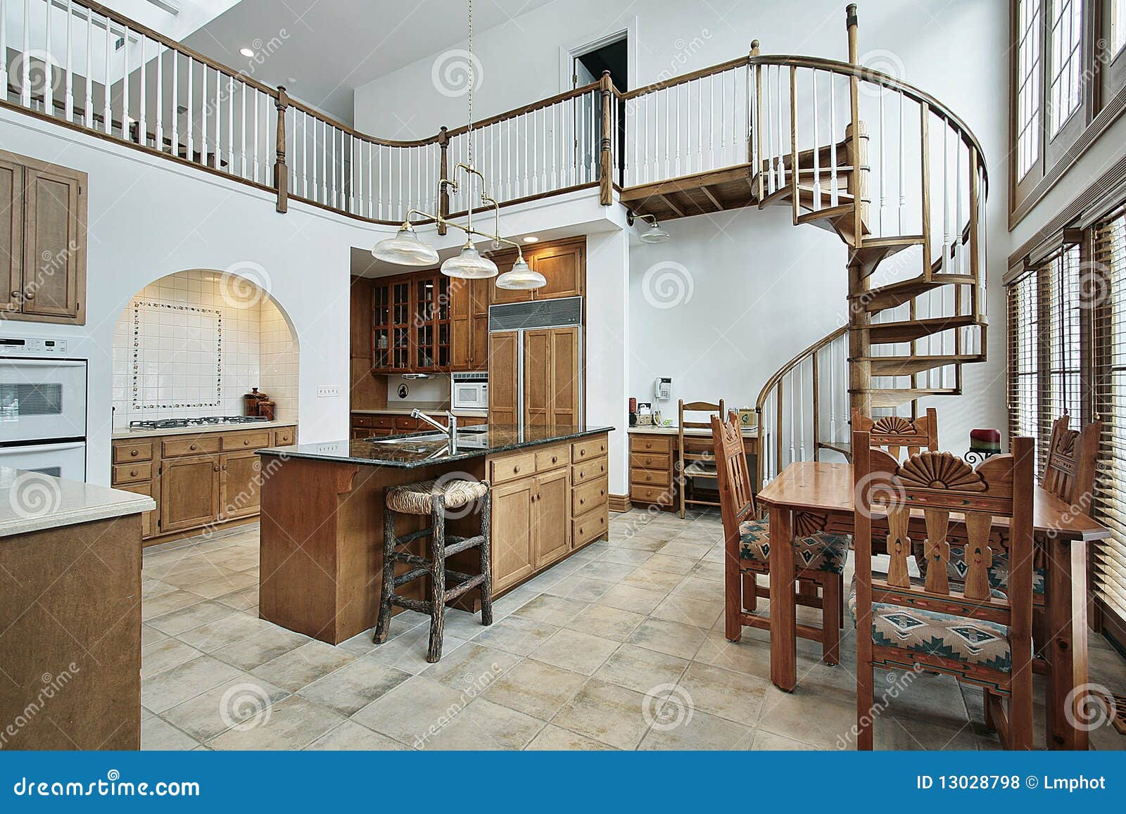 Large Kitchen with Spiral Stairway To Second Floor Stock Photo - Image ...