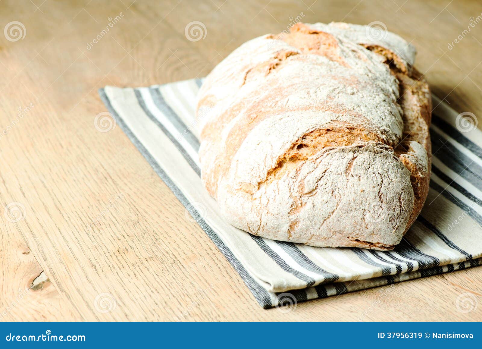 Large Loaf of Bread on Wooden Table Stock Image - Image of sunflower ...