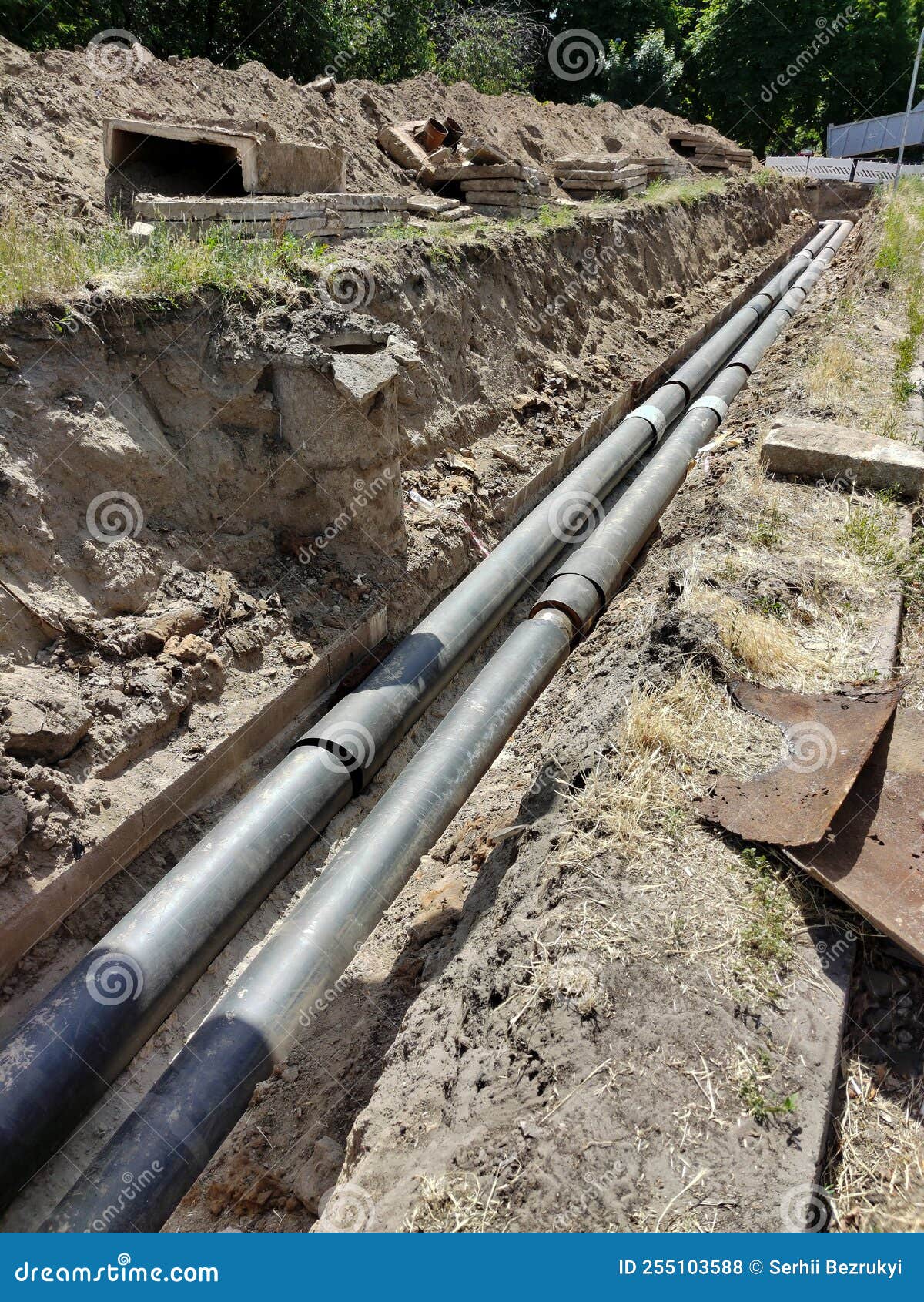 A Large Long Pit with Old Pipes at the Bottom during the Elimination of ...