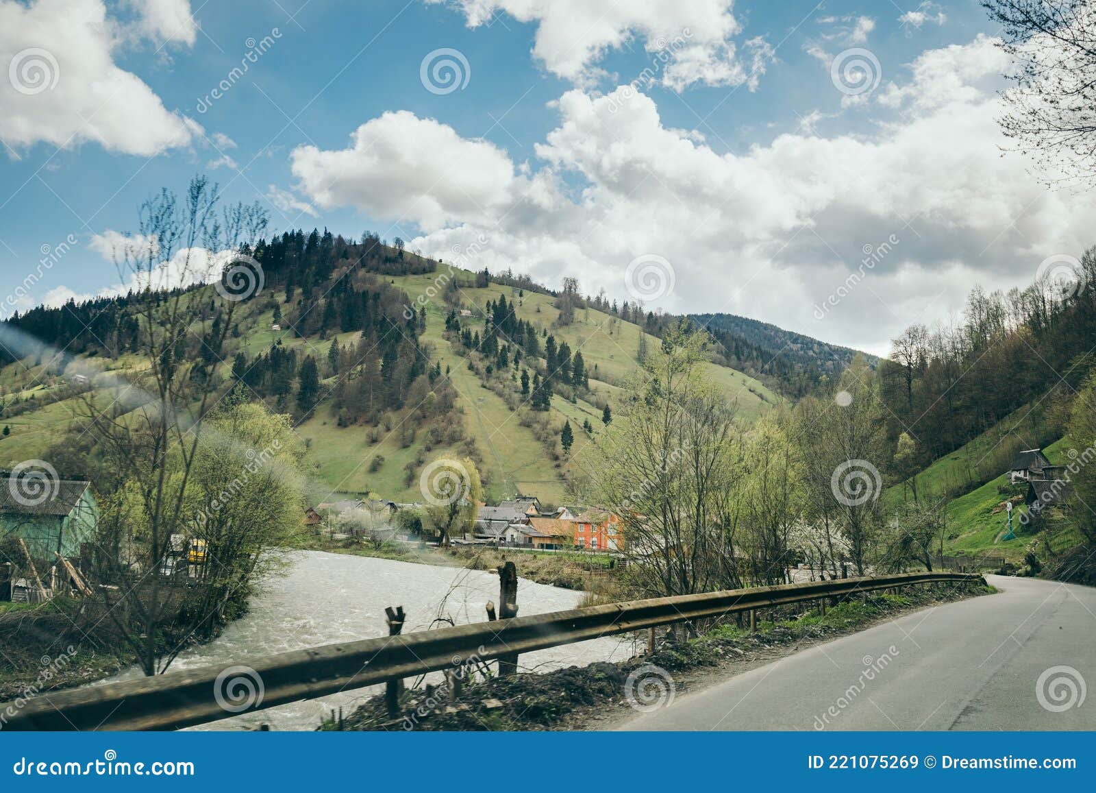 A Large Long Train on a Train Track with Trees in the Background Stock ...