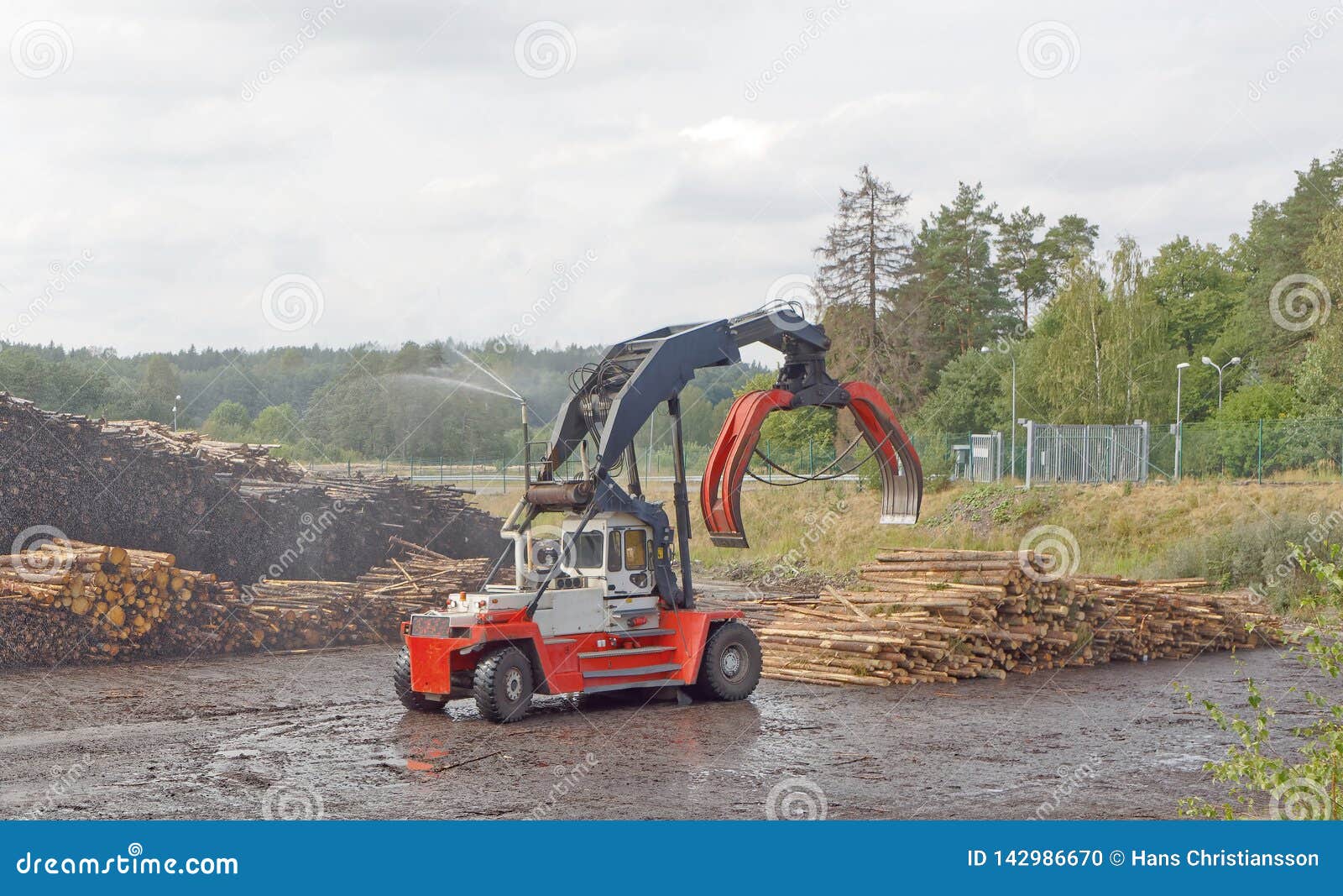 Large Machine Loading Timber at the Pulp and Paper Mill Stock Photo ...