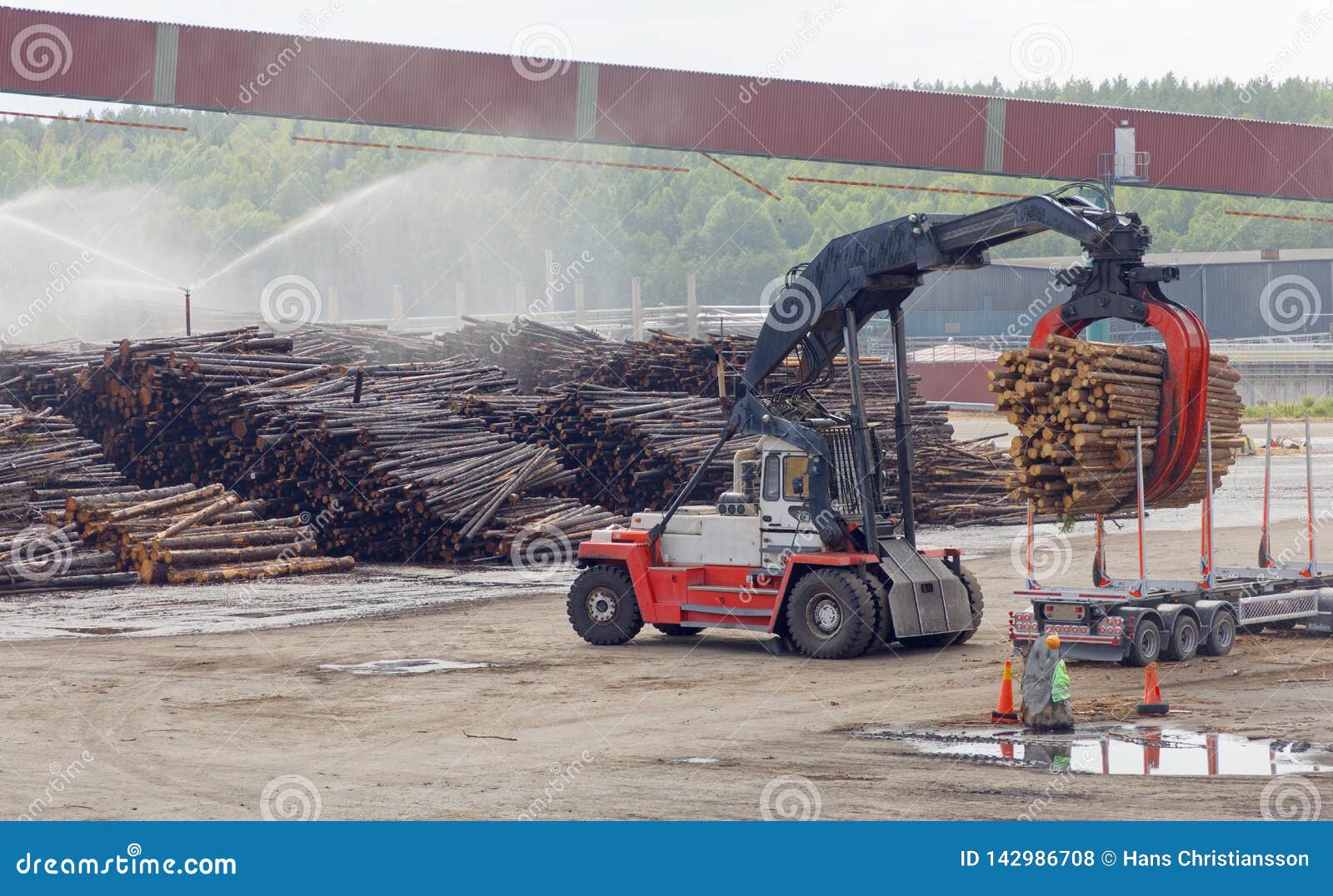 Large Machine Loading Timber at the Pulp and Paper Mill Stock Photo ...