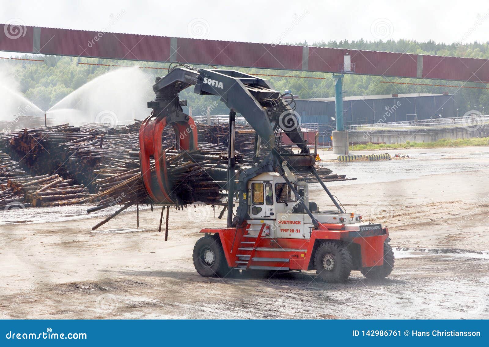 Large Machine Loading Timber at the Pulp and Paper Mill Stock Image ...