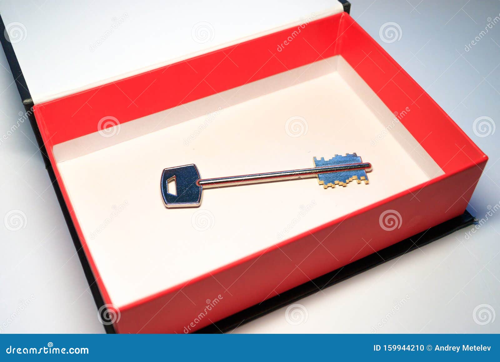 A Large Metal Key for the Door Lock in a Rectangular Cardboard Box with ...