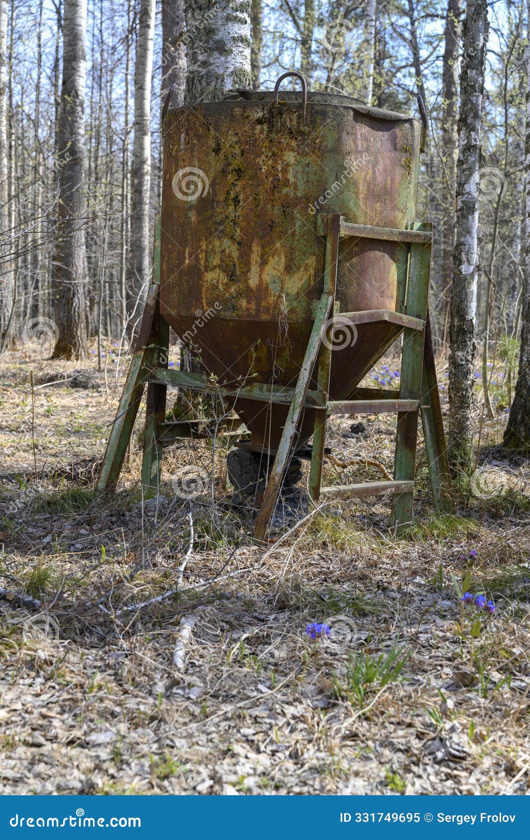 A Large Metal Old Rusty Abandoned Cylinder with a Funnel in the Spring ...