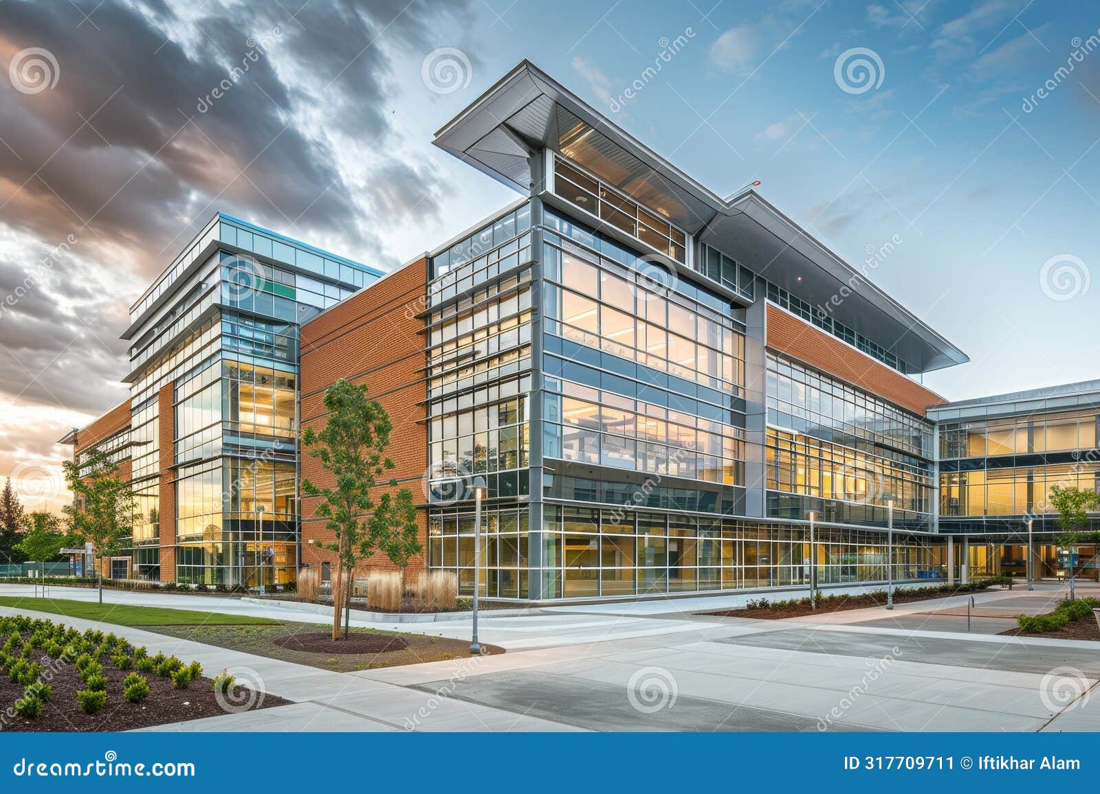 A Large, Modern School Building with a Multitude of Windows Reflecting ...