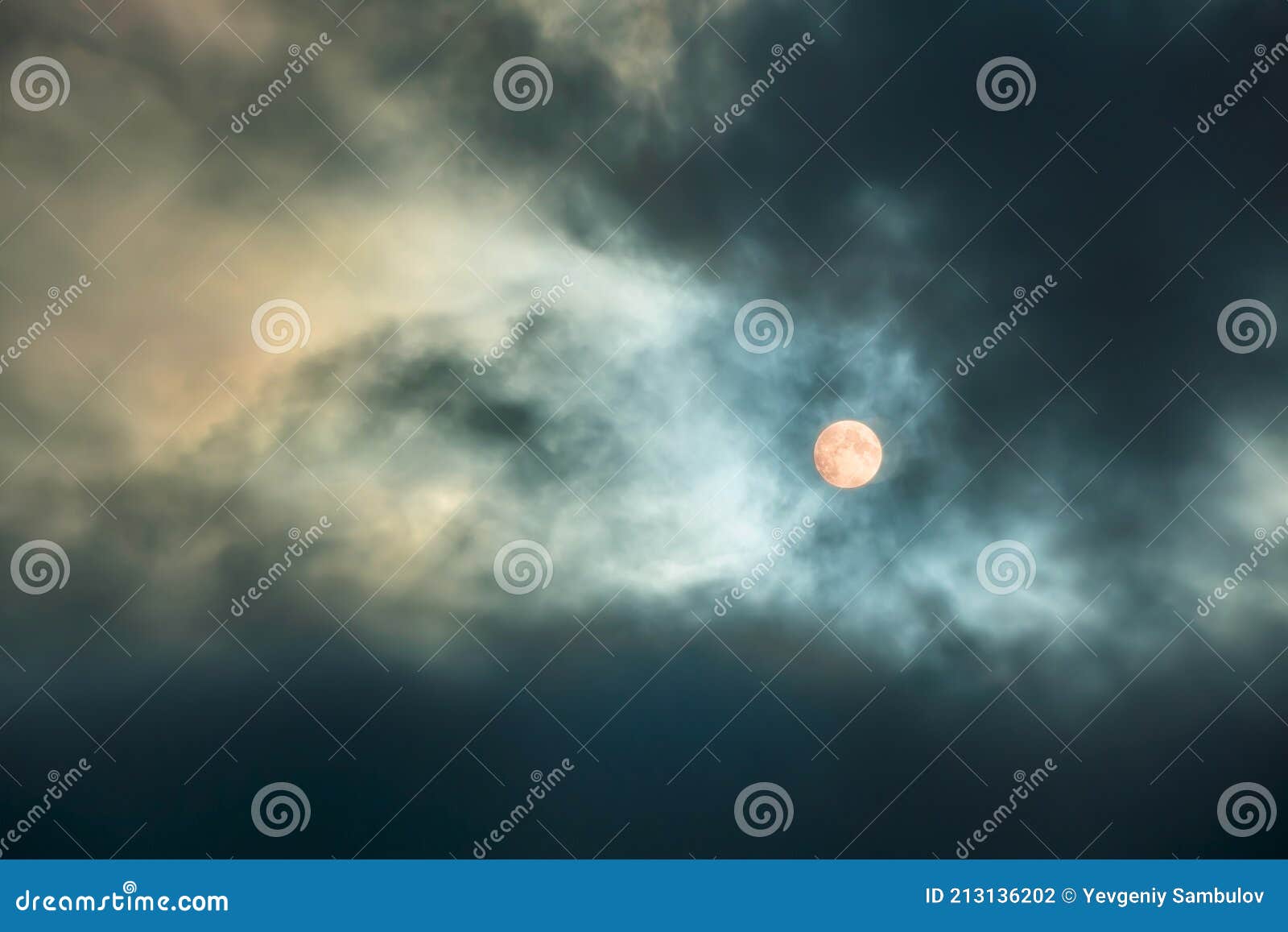 A Large Moon in a Cloudy Sky with Thick Clouds. Full Moon. the Night ...