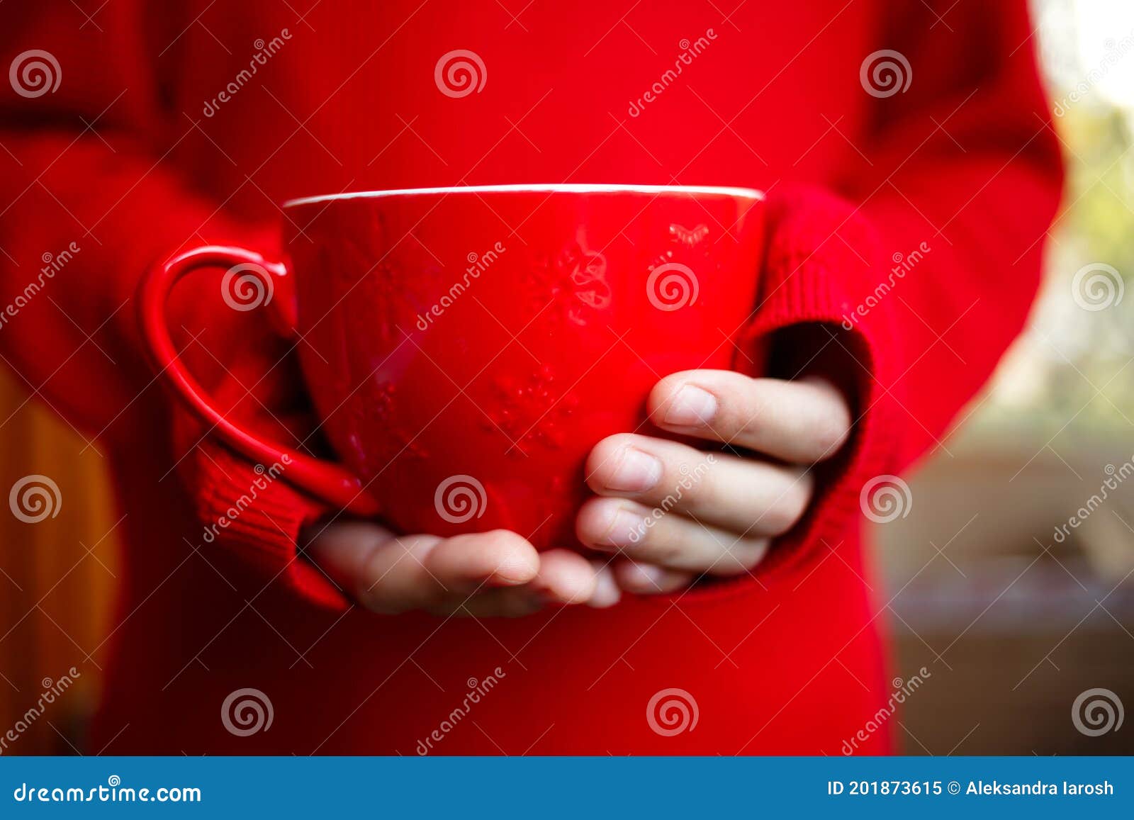 A Large Mug in the Hands of a Child on a Red Background Stock Image ...