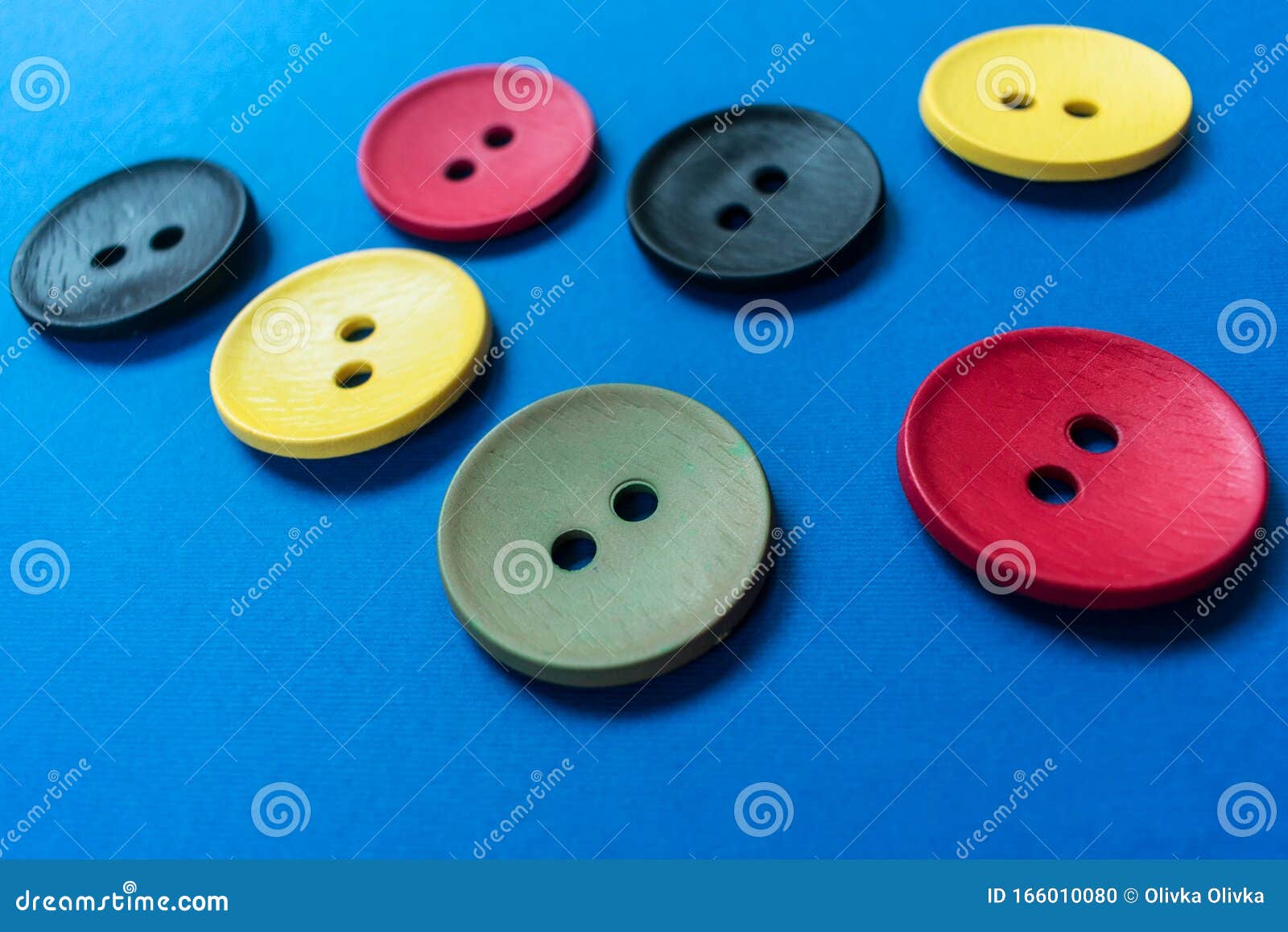 Large Multi-colored Buttons on a Blue Background. Stock Photo - Image ...