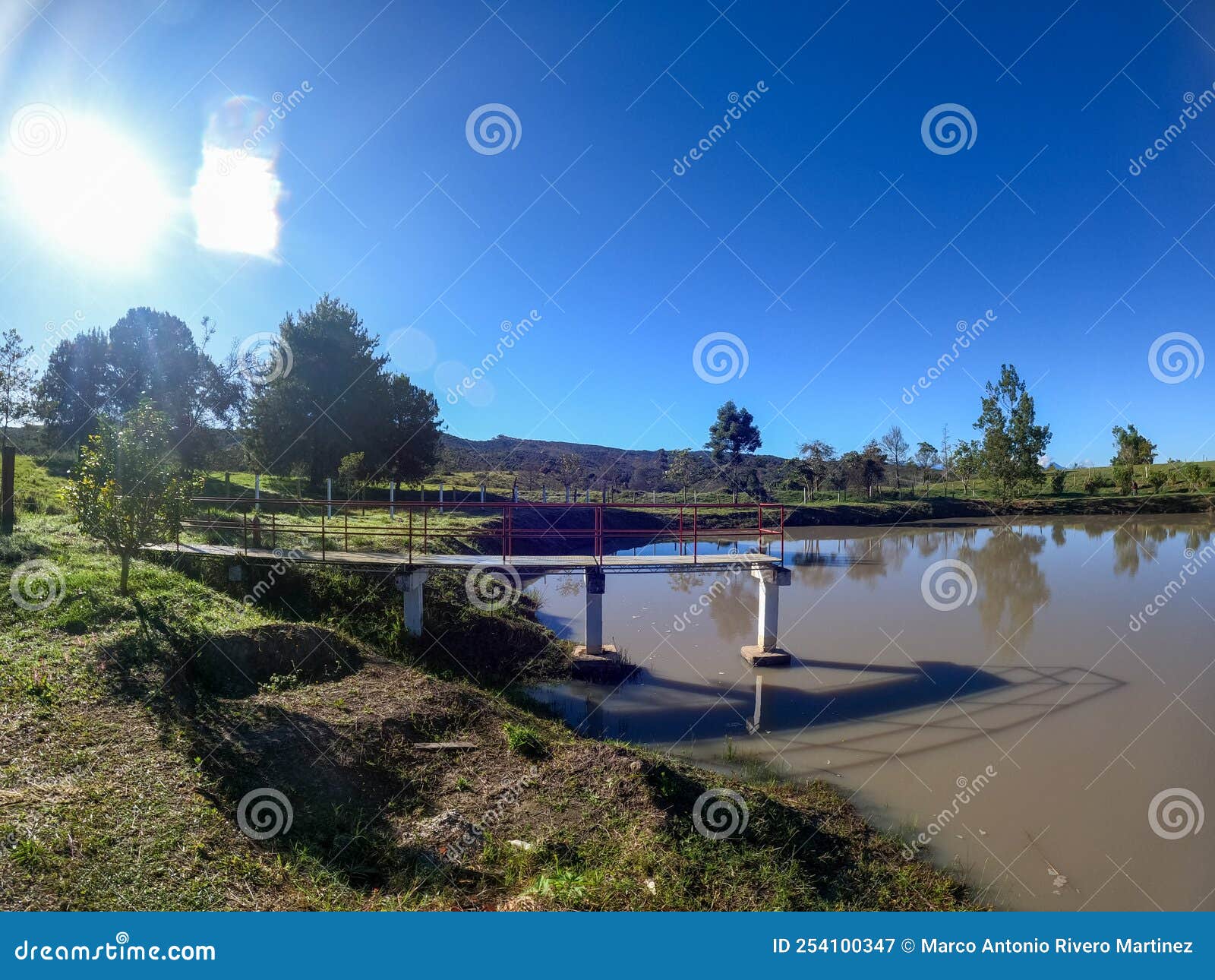 Large Natural Well with Mountains in the Background Stock Image - Image ...