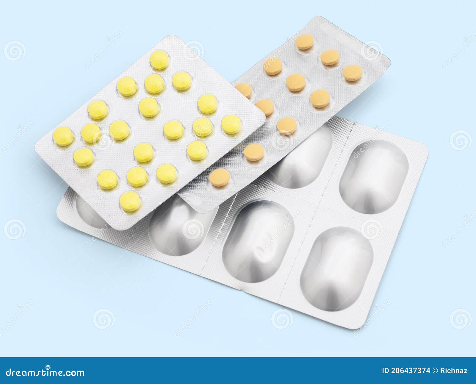 A Large Number of Capsules in a Silver Package on a Colored Background ...