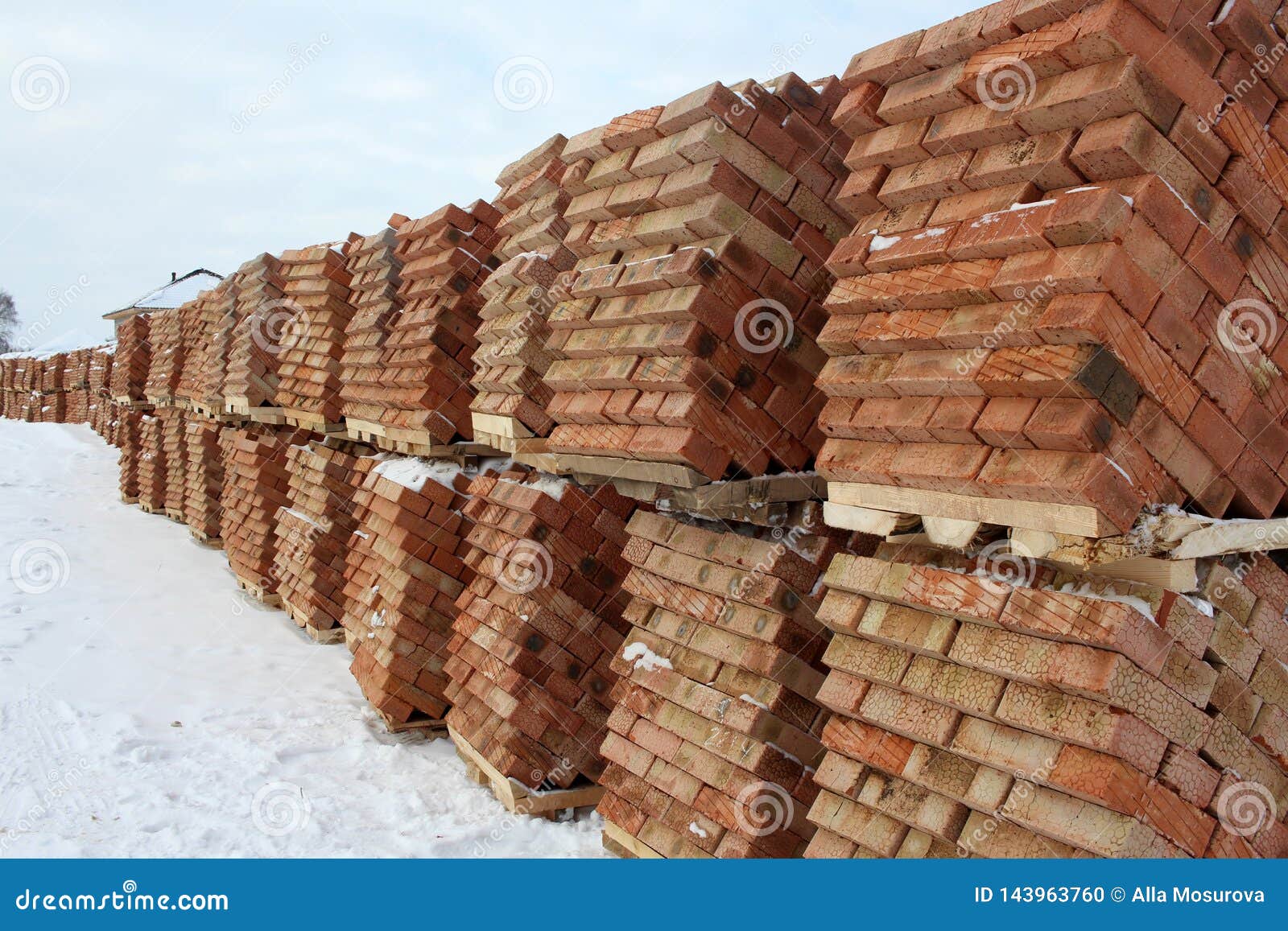A Large Number of Stacked Bricks on Pallets Prepared for Construction ...