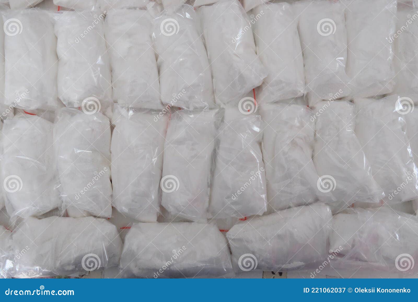 A Large Number of Transparent Sachets Filled with White Powder. White ...