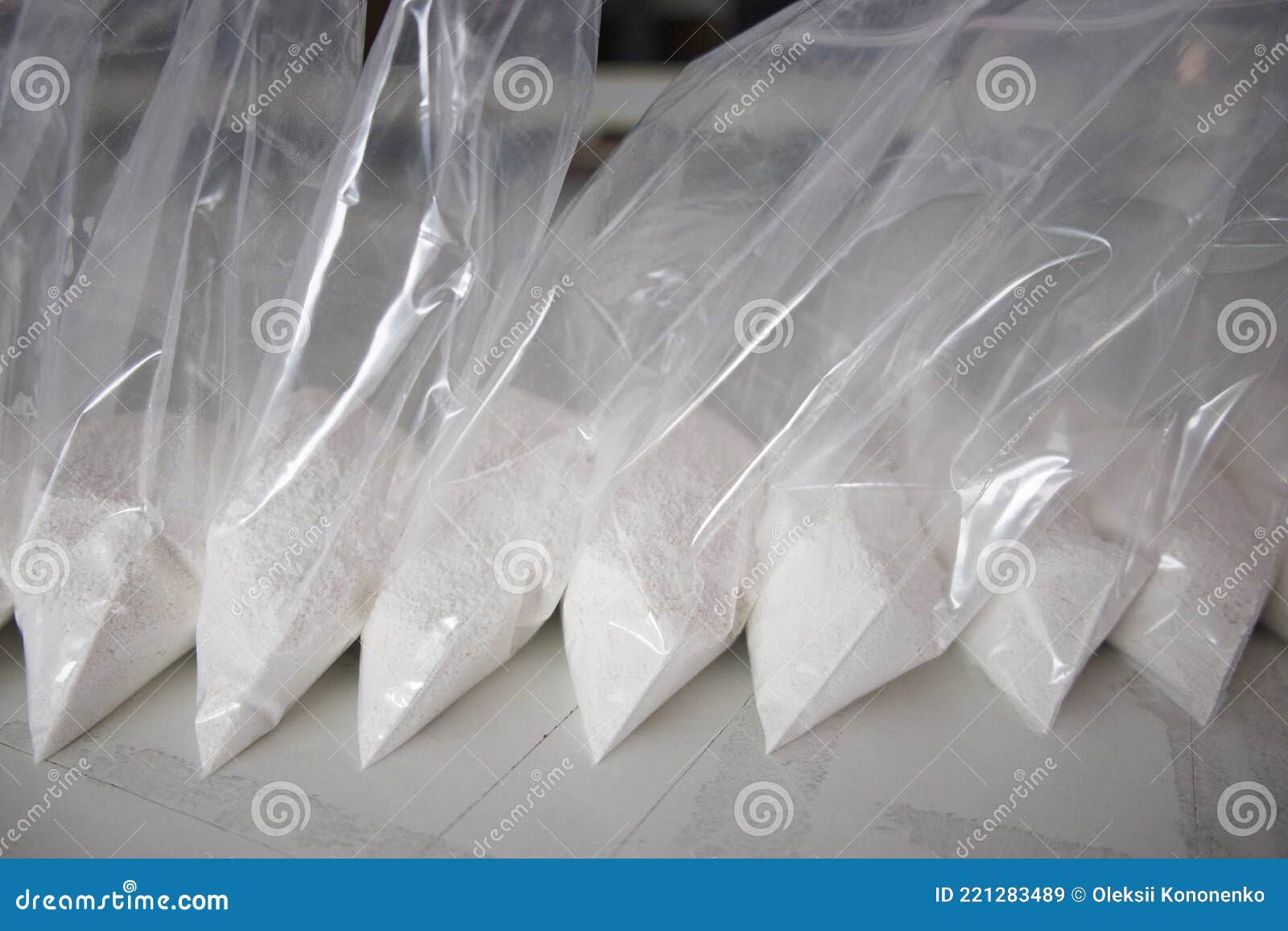 A Large Number of Transparent Sachets Filled with White Powder. White ...