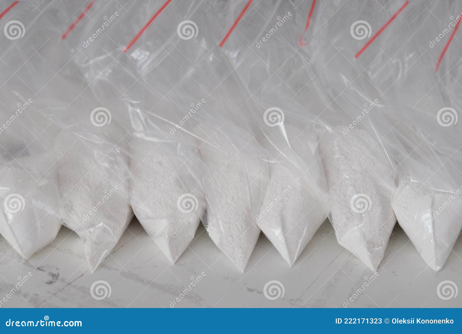 A Large Number of Transparent Sachets Filled with White Powder. White ...