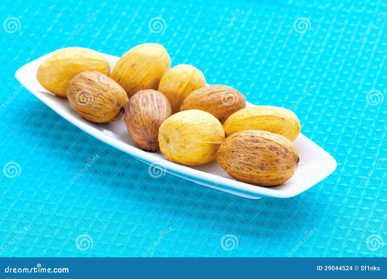 Large nuts on a plate stock photo. Image of object, nature - 29044524