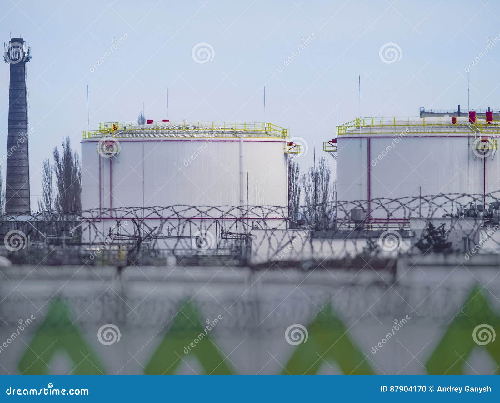 Large Oil Tanks in a Fenced Area Stock Photo - Image of energy, barrels ...