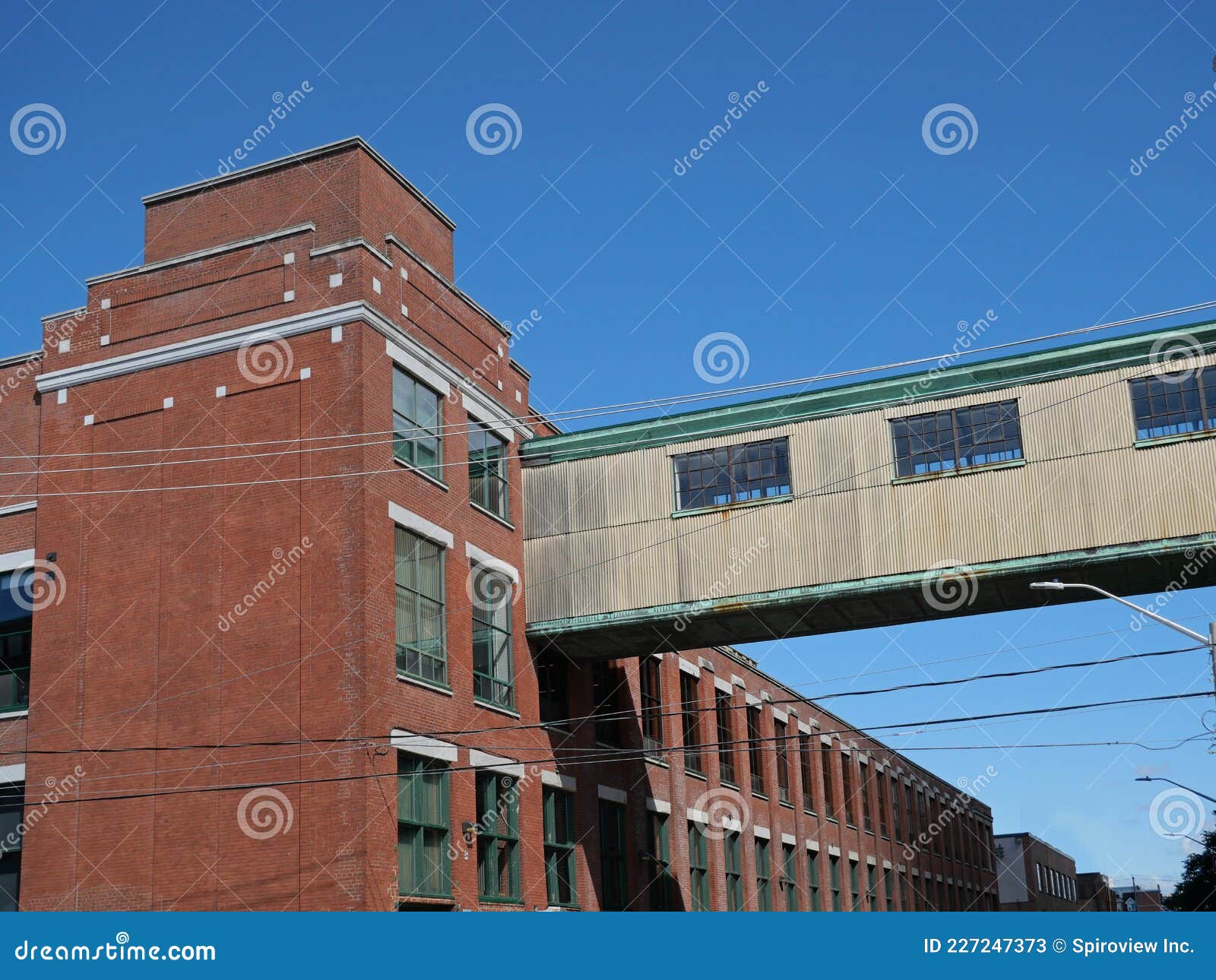 Large Old Brick Factory Building with Catwalk Stock Image - Image of ...