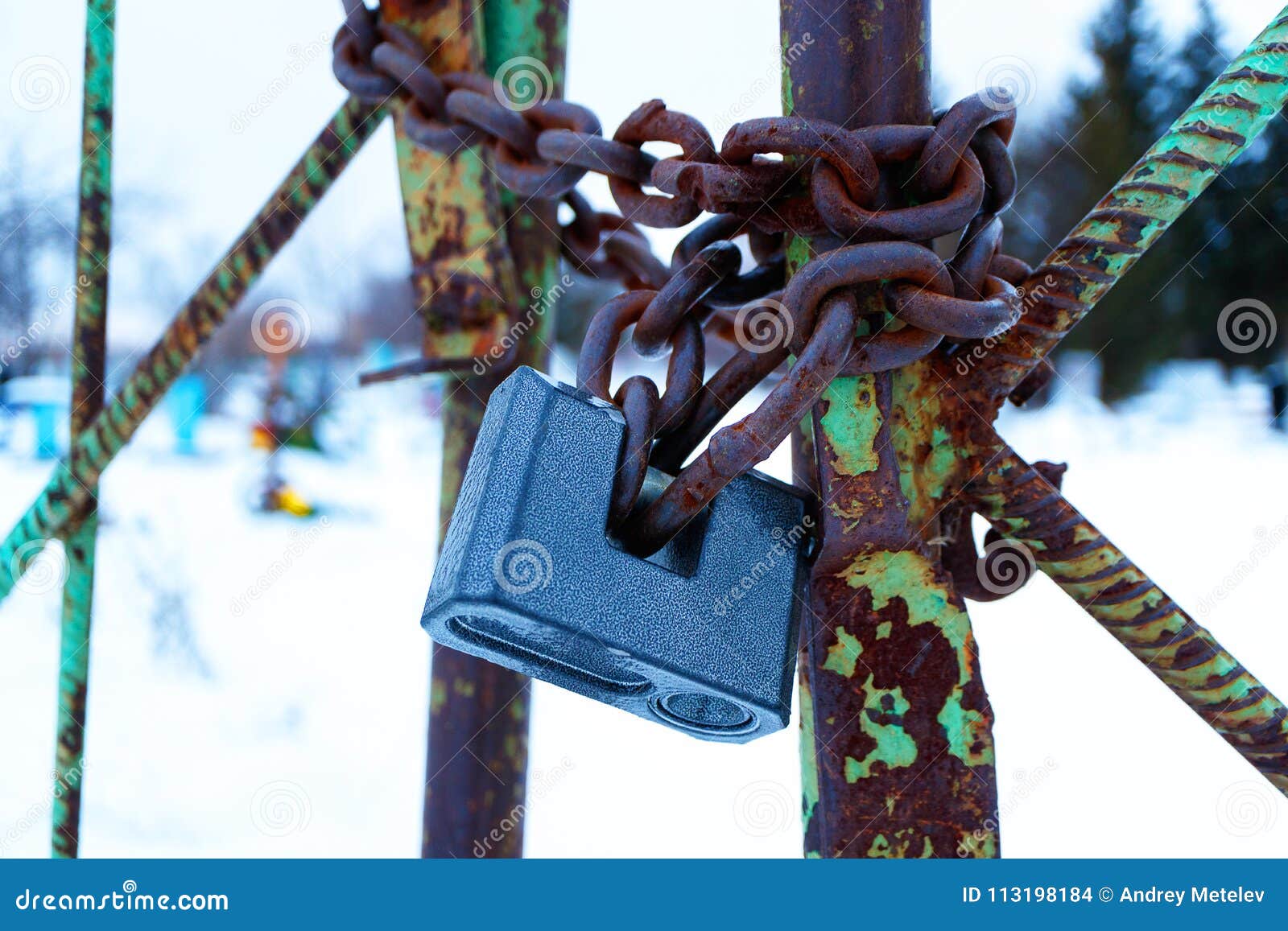 A Large Old Pendant Castle on a Rusty Old Gate, a Chain and a Lock on ...