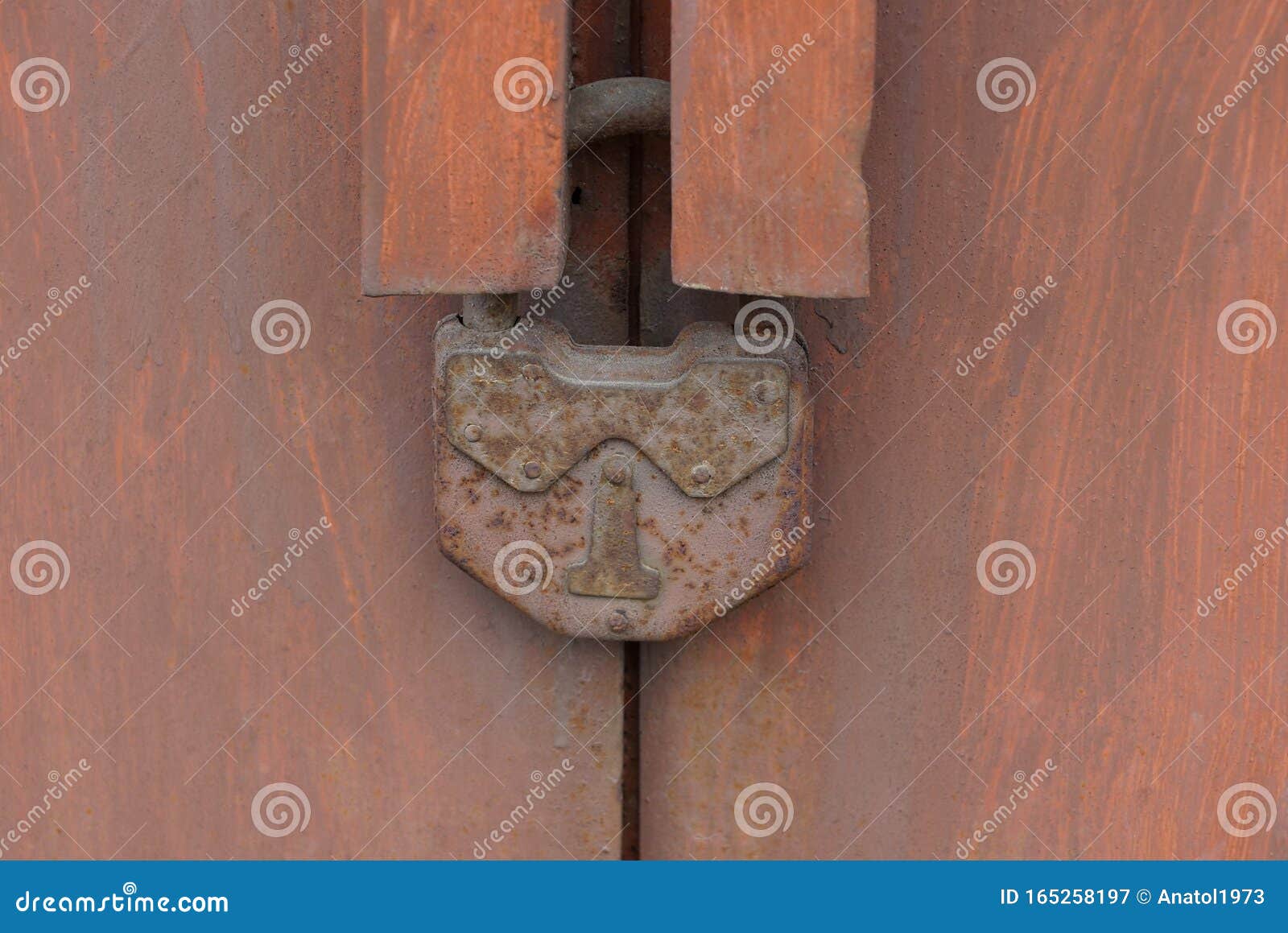 Old Rusty Iron Lock Hanging on a Brown Metal Gate Stock Image - Image ...