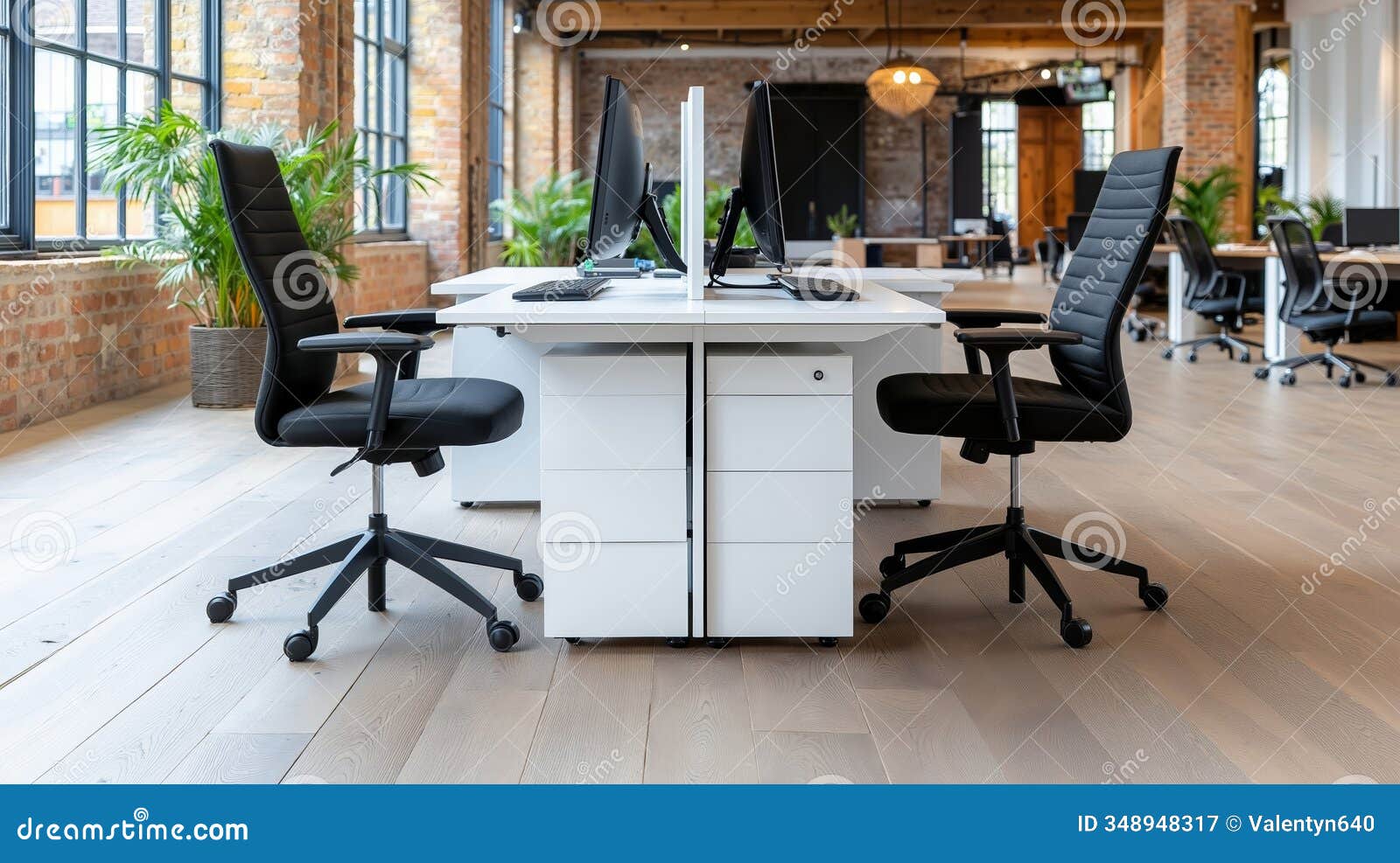 A Large Open Plan Office with Two Computer Desks and Two Chairs Stock ...