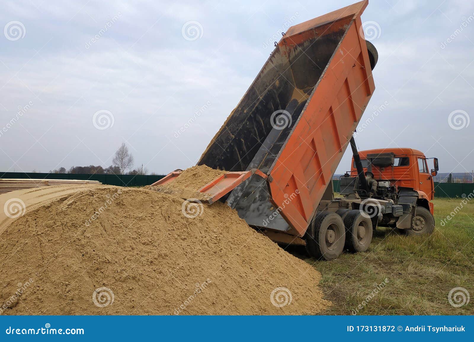 A Large Orange Dump Truck Unloads the Sand Stock Photo - Image of ...